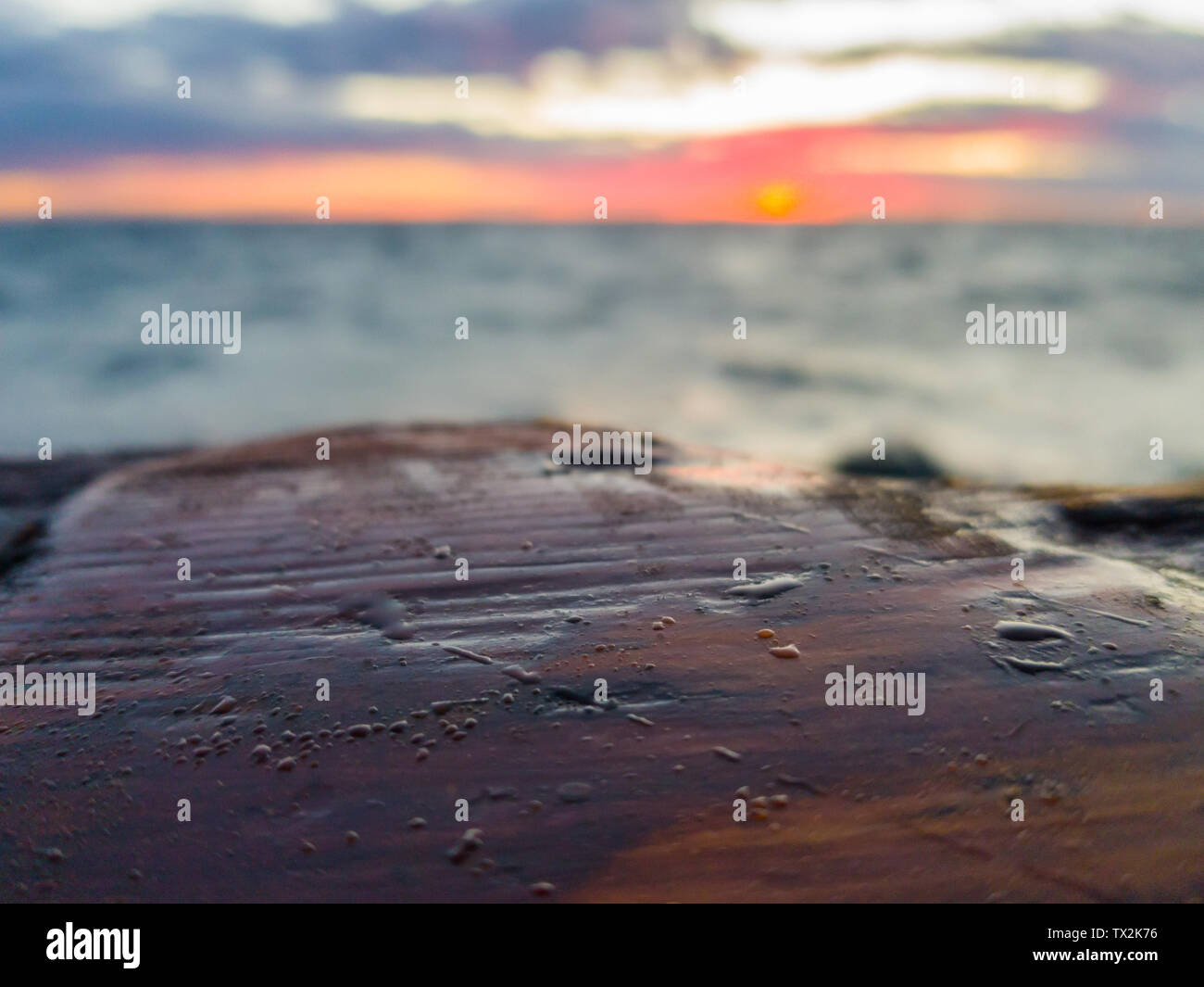 Water droplets on a wooden gunwale old sailing ship. Selective focus ...
