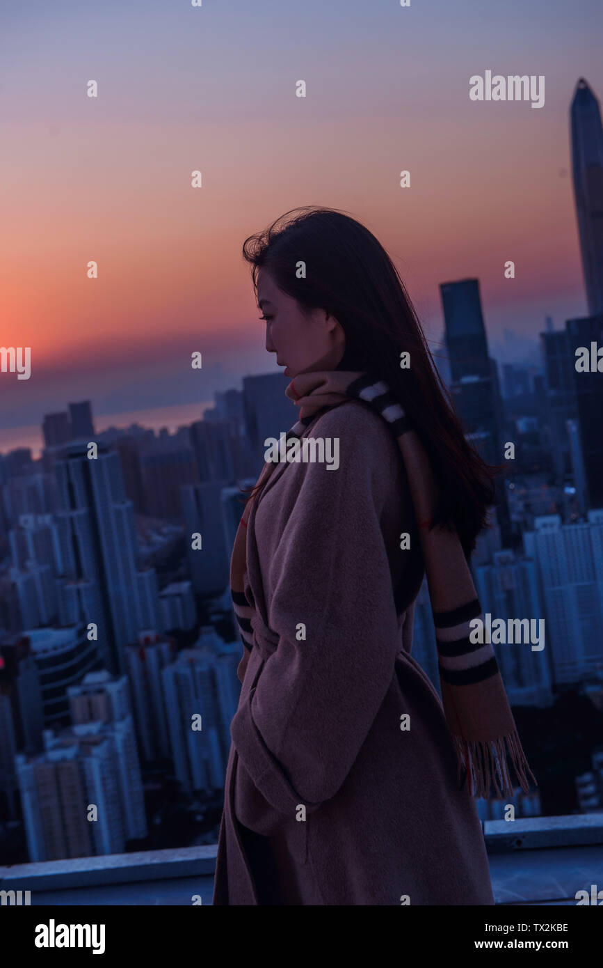 Girl on the rooftop Stock Photo - Alamy