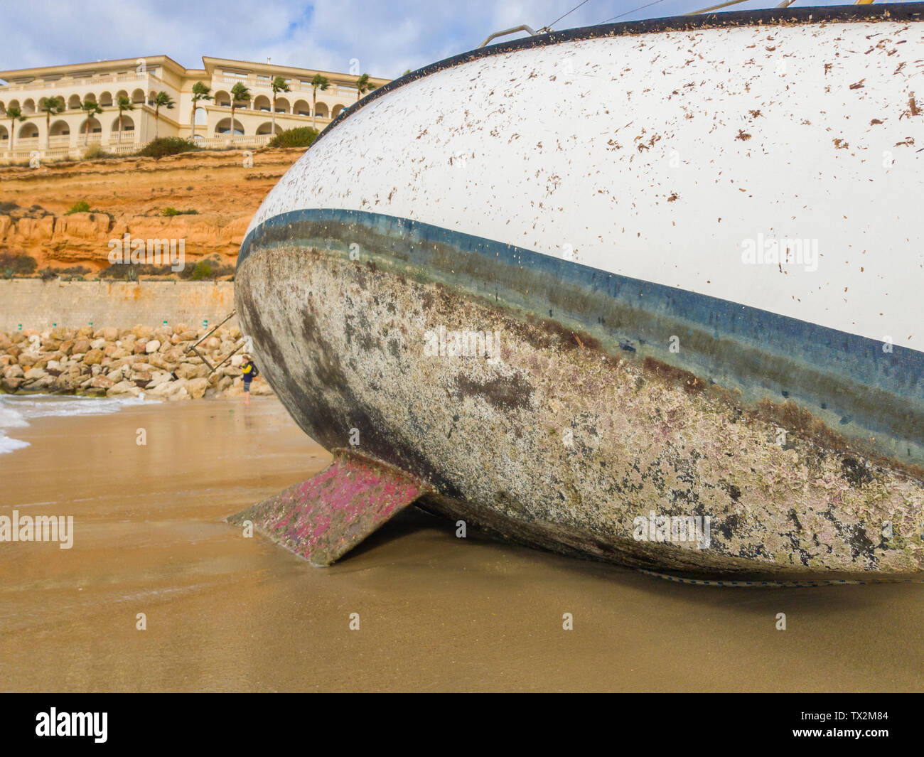 The bottom of a careening yacht on the coast. The sailing yacht was a ...