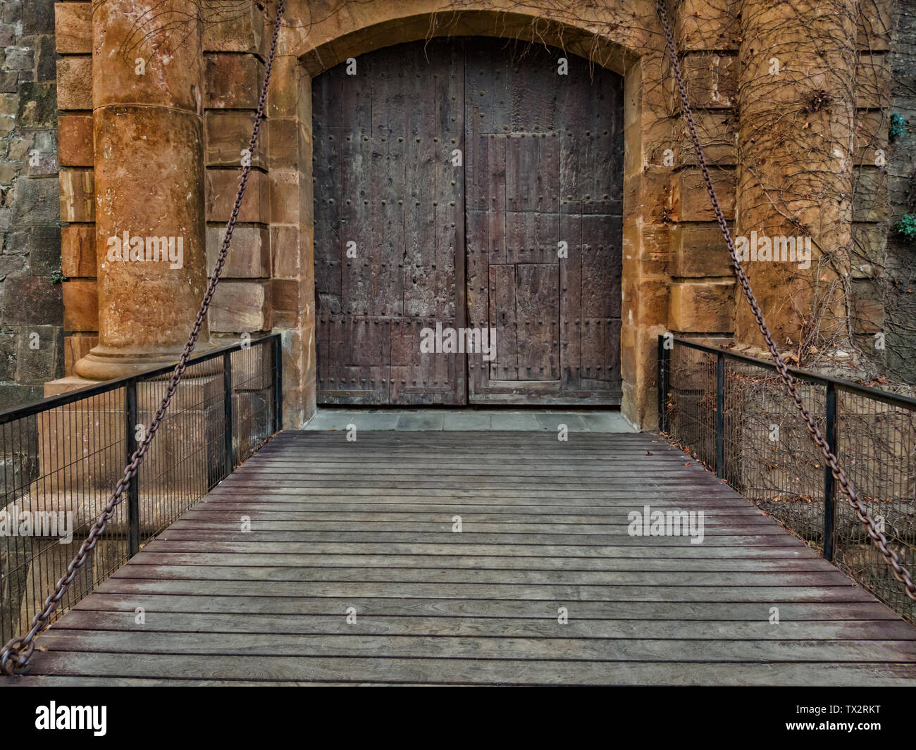 Wooden gates of the stone fortress Stock Photo - Alamy
