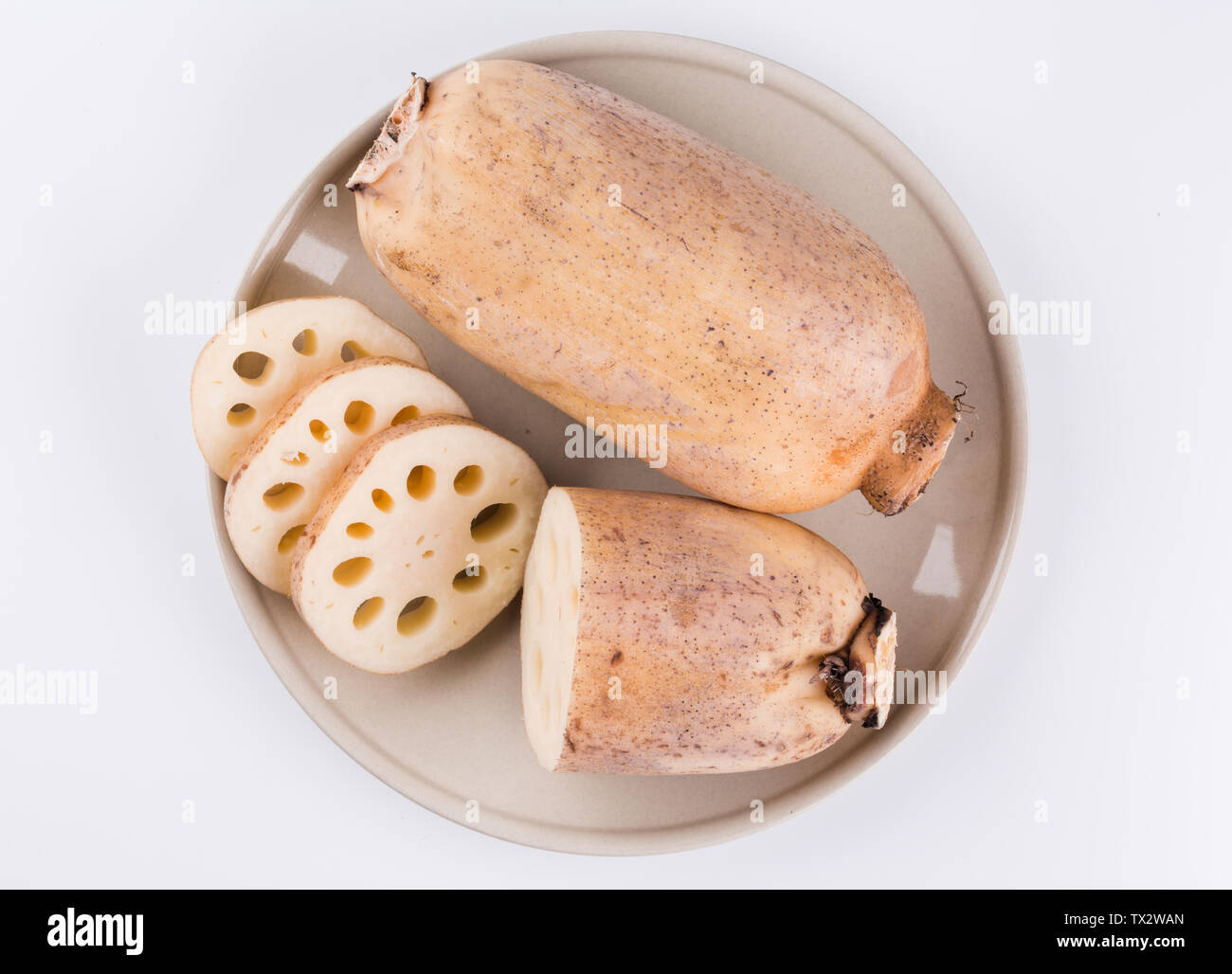 Fresh lotus root on white background Stock Photo - Alamy