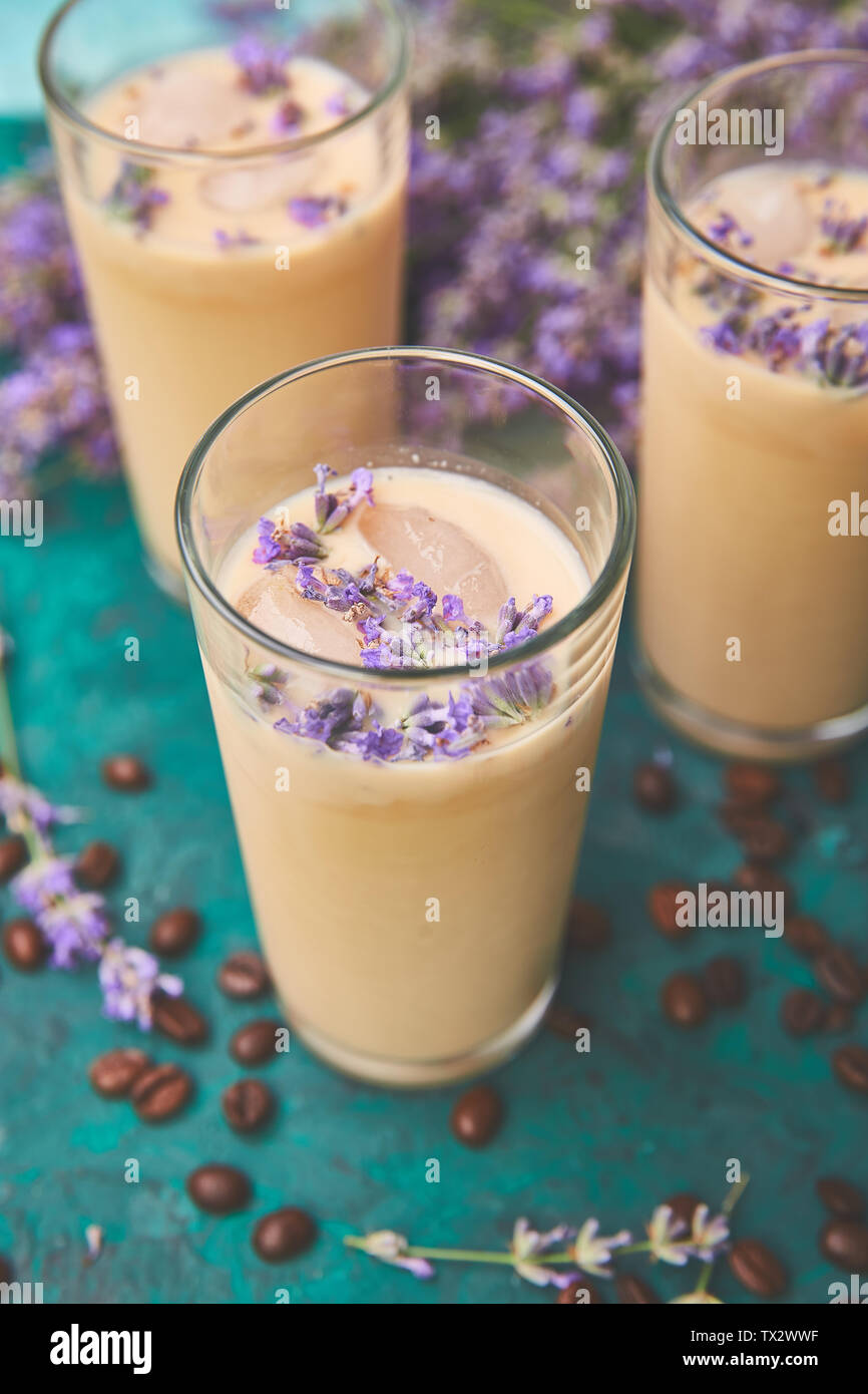 Summer drink iced coffee with lavender in glass and coffee beans on ...