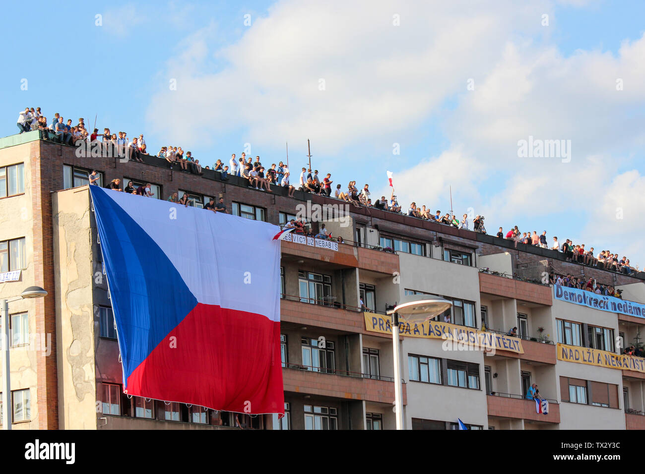 Prague, Czech Republic - June 23 2019: People on a roof of a building ...