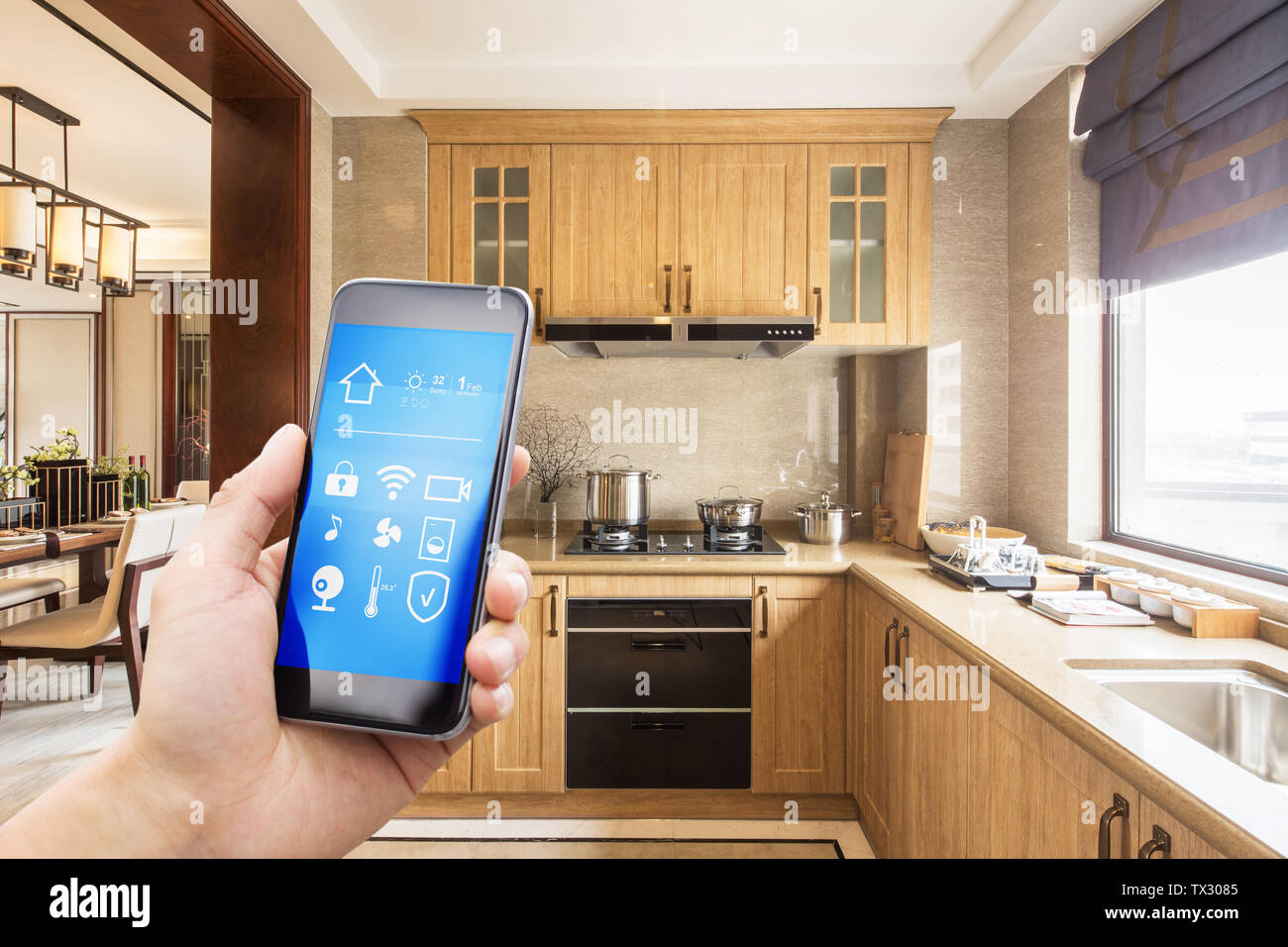 smart phone with smart home with modern kitchen Stock Photo - Alamy