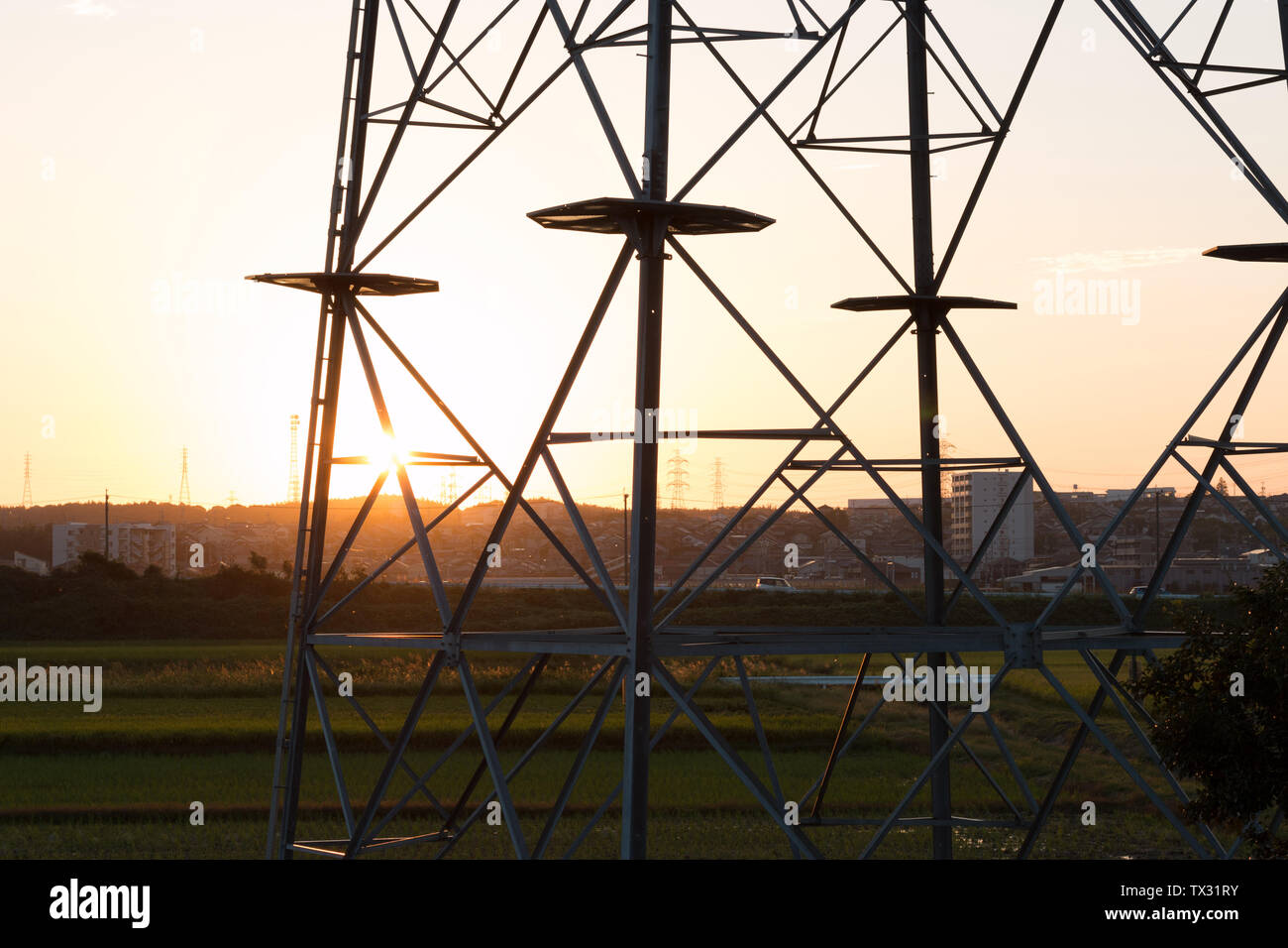 Half mast tower electrical power line in sunset time Stock Photo - Alamy