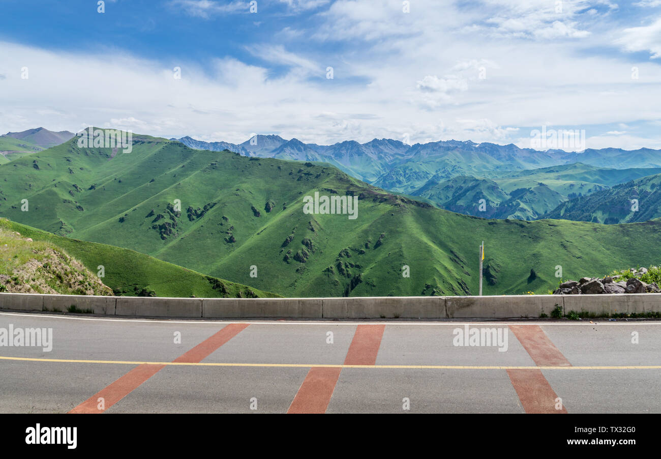 G217 Duku Highway in Alpine Forest under Summer Blue Sky and White ...