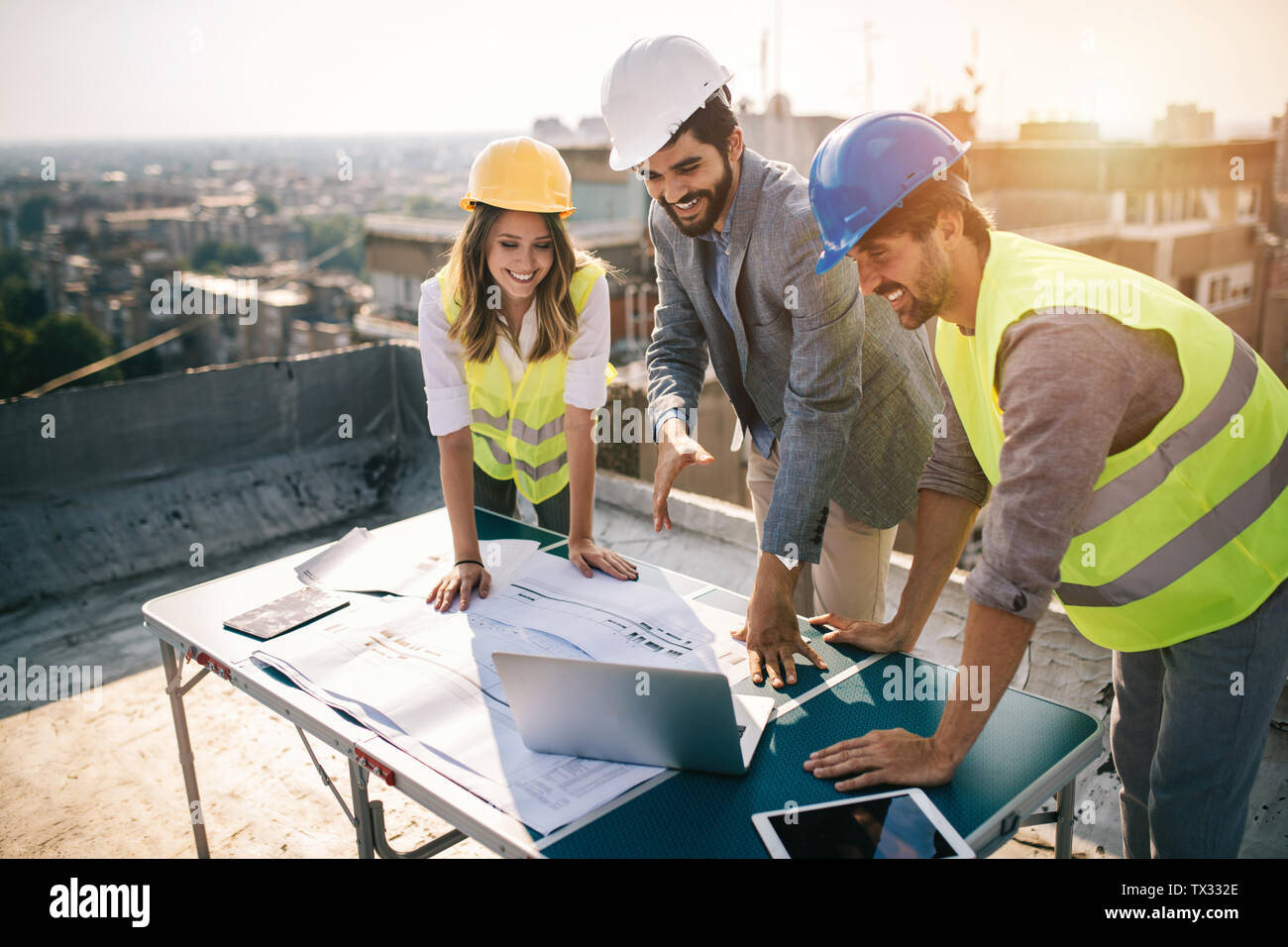 Architects, business manager and engineer meeting project at building ...