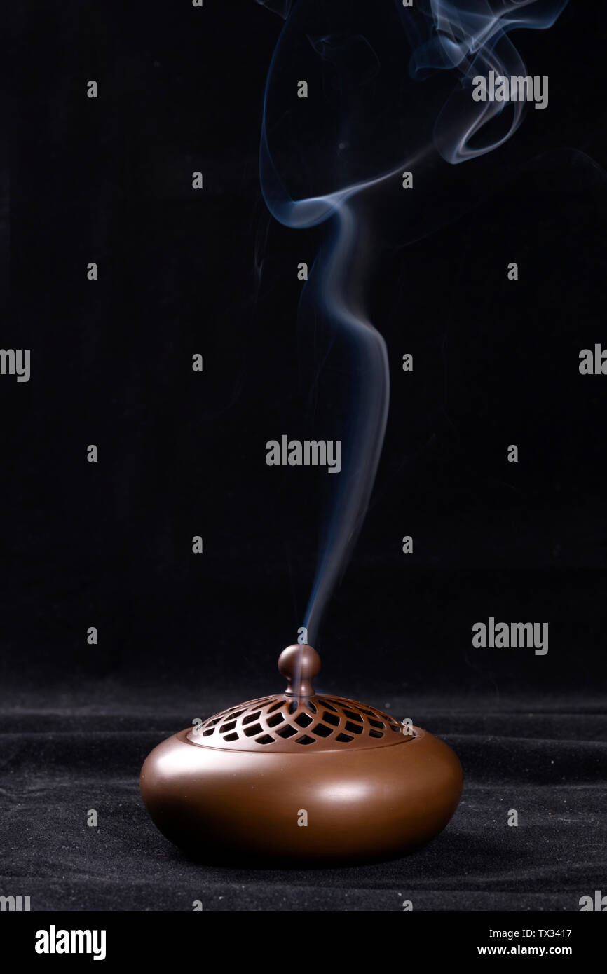 Copper incense stove Stock Photo - Alamy