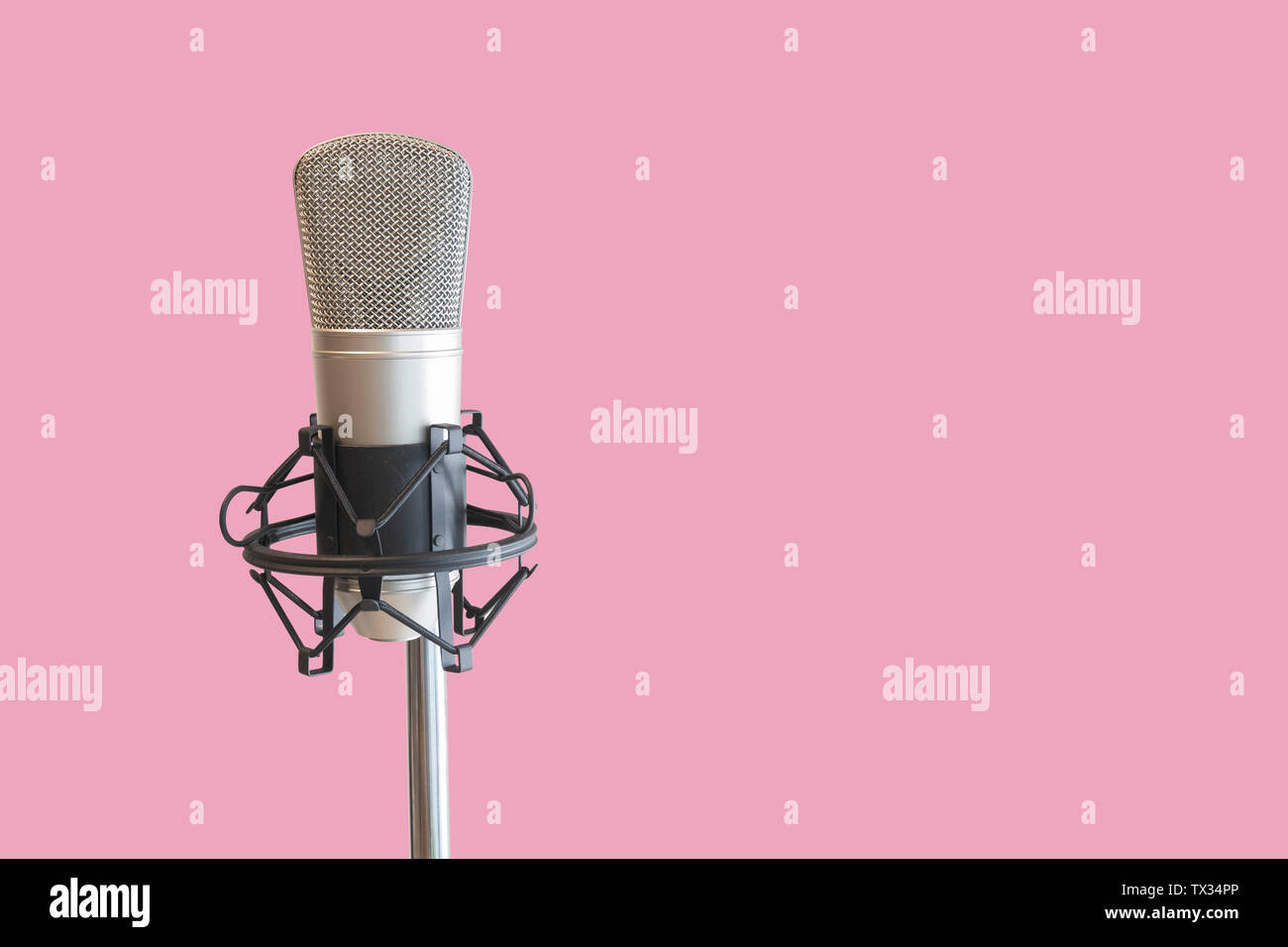 Condenser mic with pink background Stock Photo - Alamy