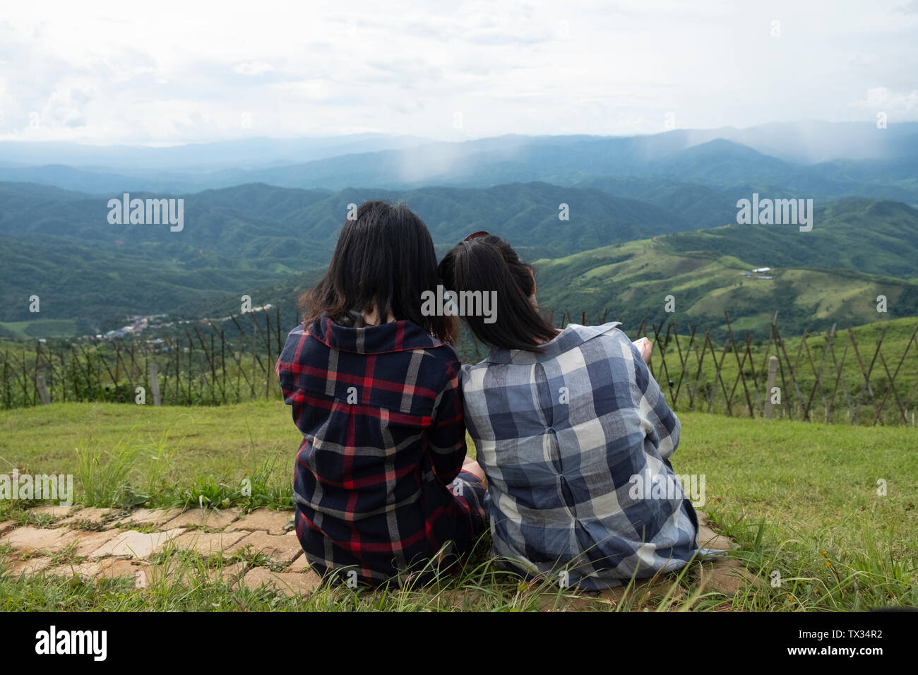 Woman sitting between friends hi-res stock photography and images - Alamy