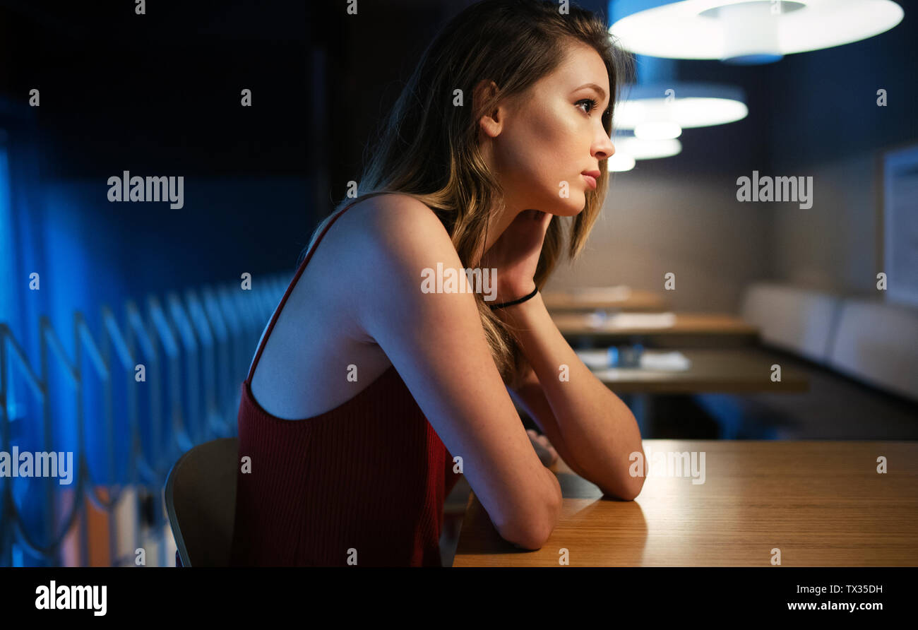 Portrait of clever young woman thinking alone Stock Photo - Alamy