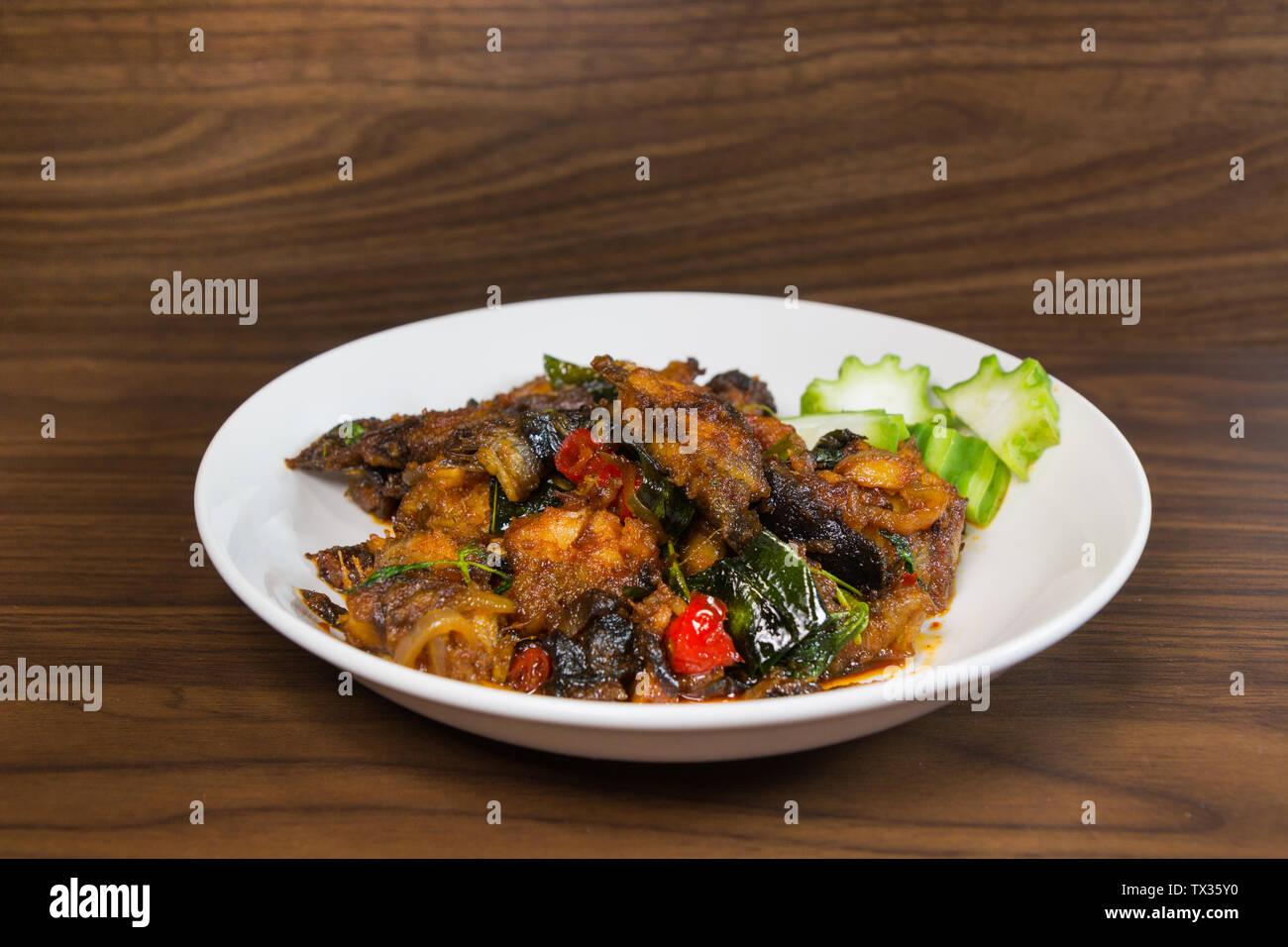 phad pla duk krob (stir fried deep fried catfish with curry paste ...