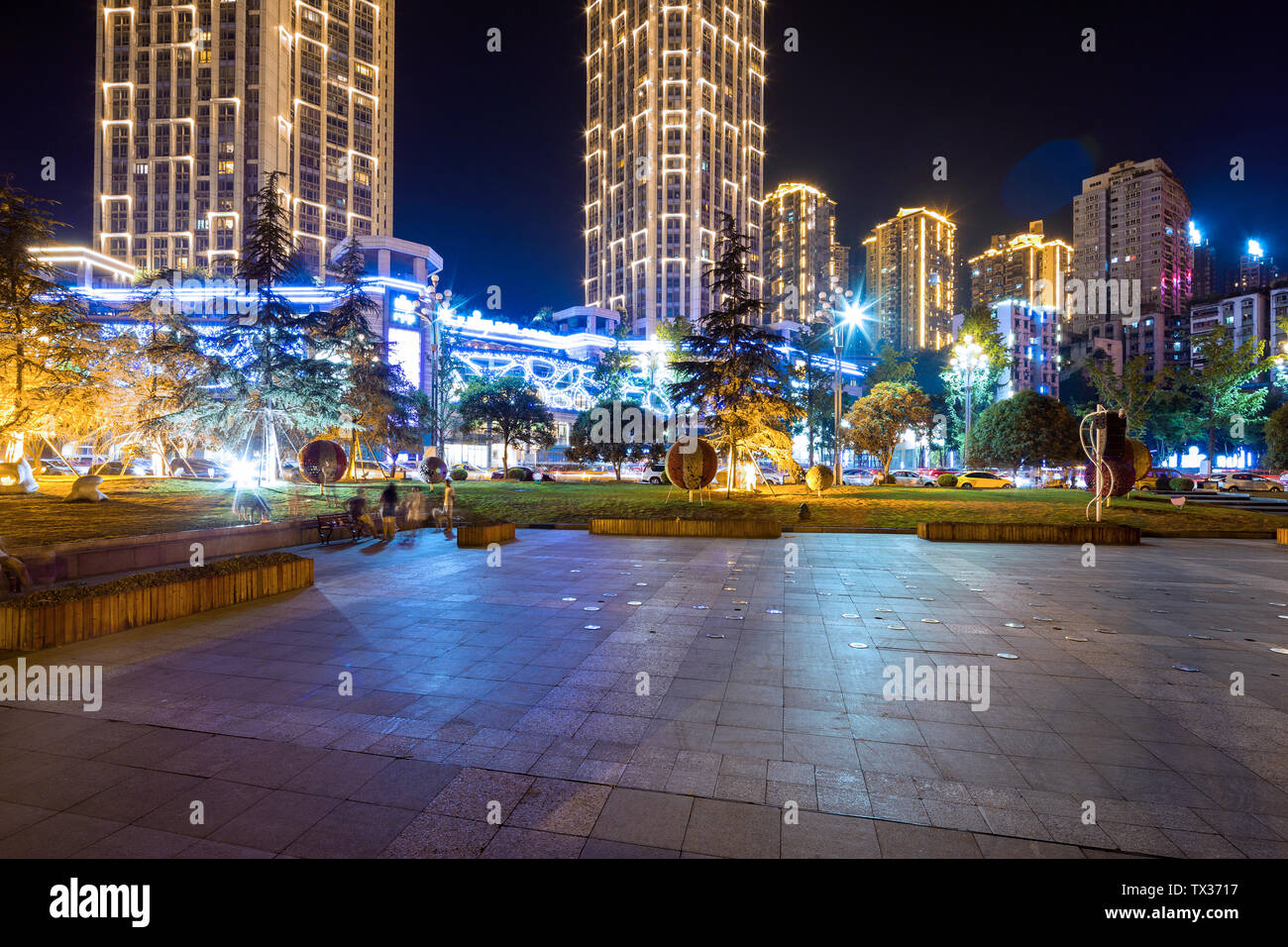 Empty floor and illuminated skyscraper Stock Photo - Alamy