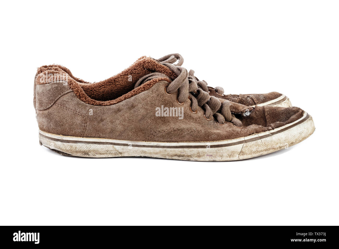 Side angle view of The old brown sneakers , isolated on a white ...