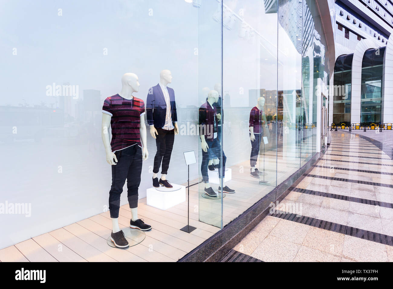 mannequins in fashion shop display window Stock Photo - Alamy