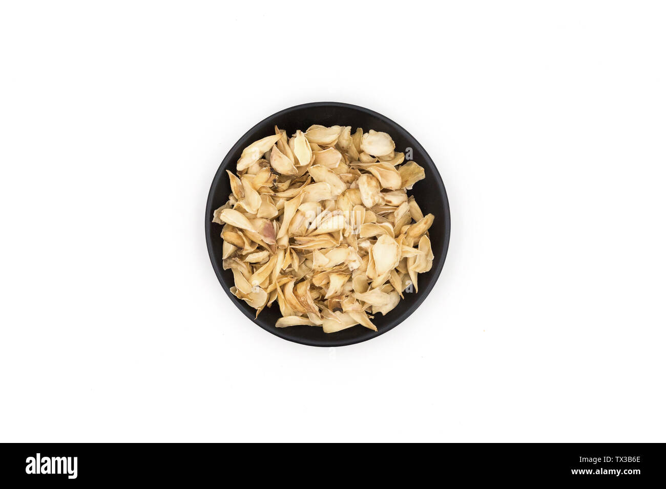 Dried lily tablets on white background, traditional Chinese medicine ...
