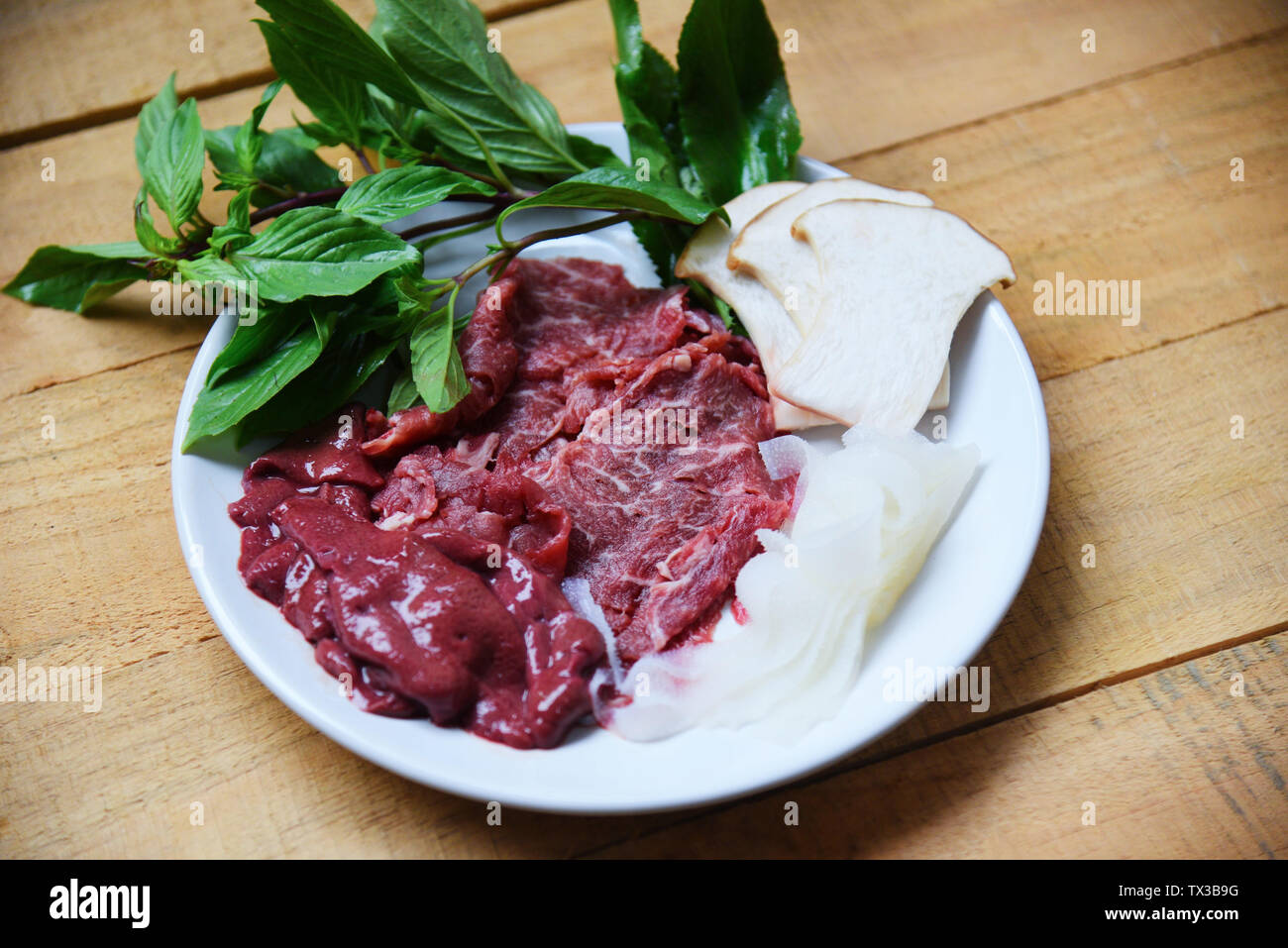 Set of meat beef slice liver and mushroom vegetables on white plate for ...