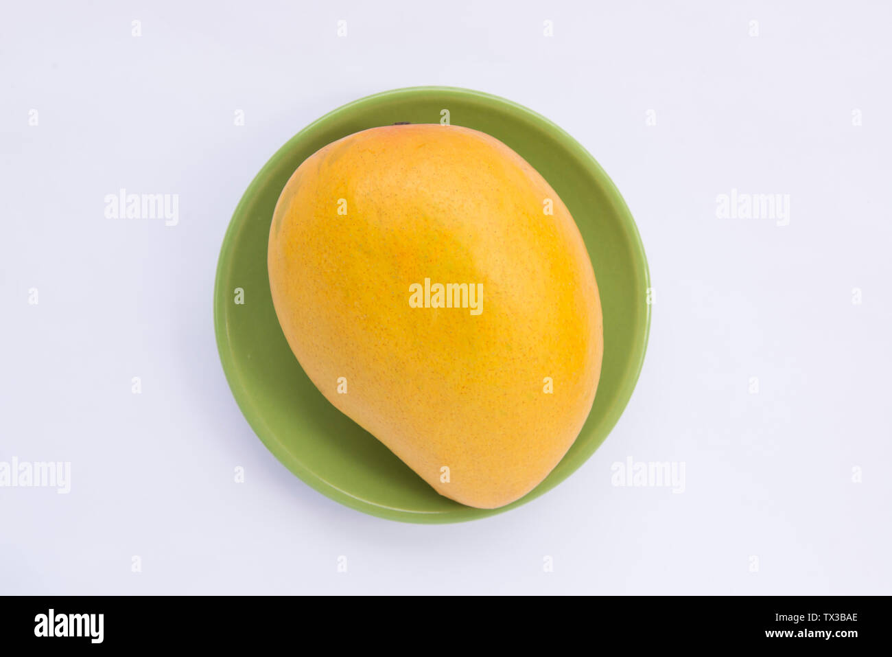 A mango on a white background Stock Photo - Alamy