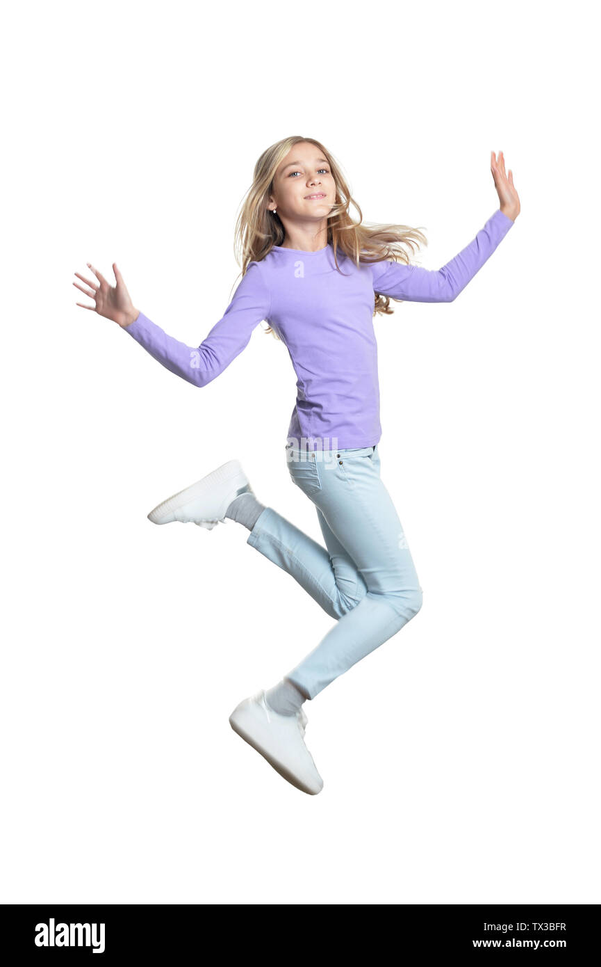 Portrait of cute little girl jumping isolated Stock Photo - Alamy