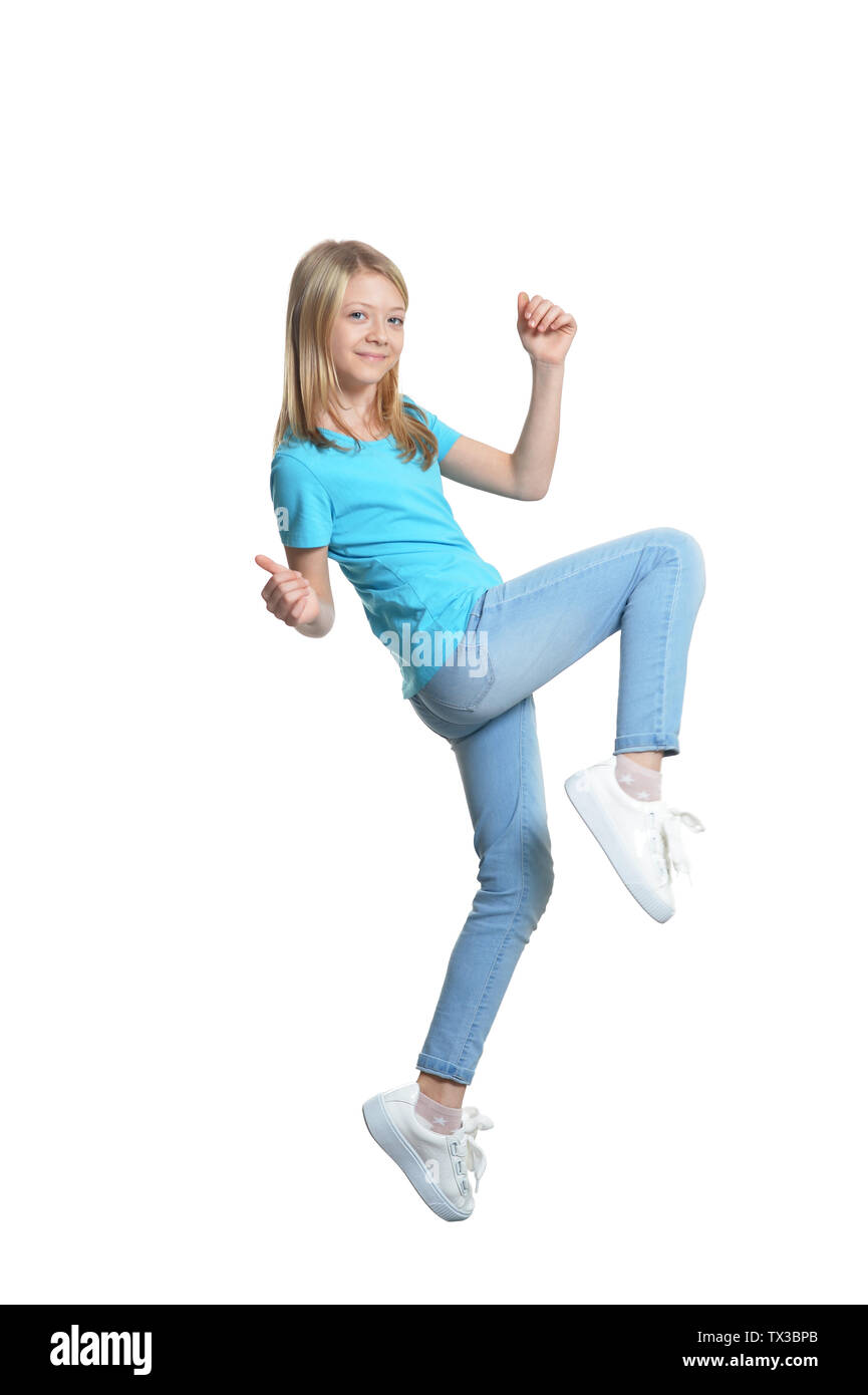Portrait of cute little girl jumping isolated Stock Photo - Alamy