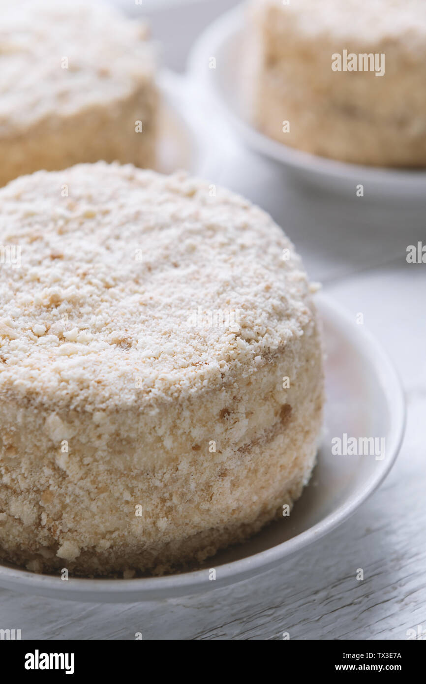 Cake Napoleon on white plate. Russian cuisine, multi layered cake with ...