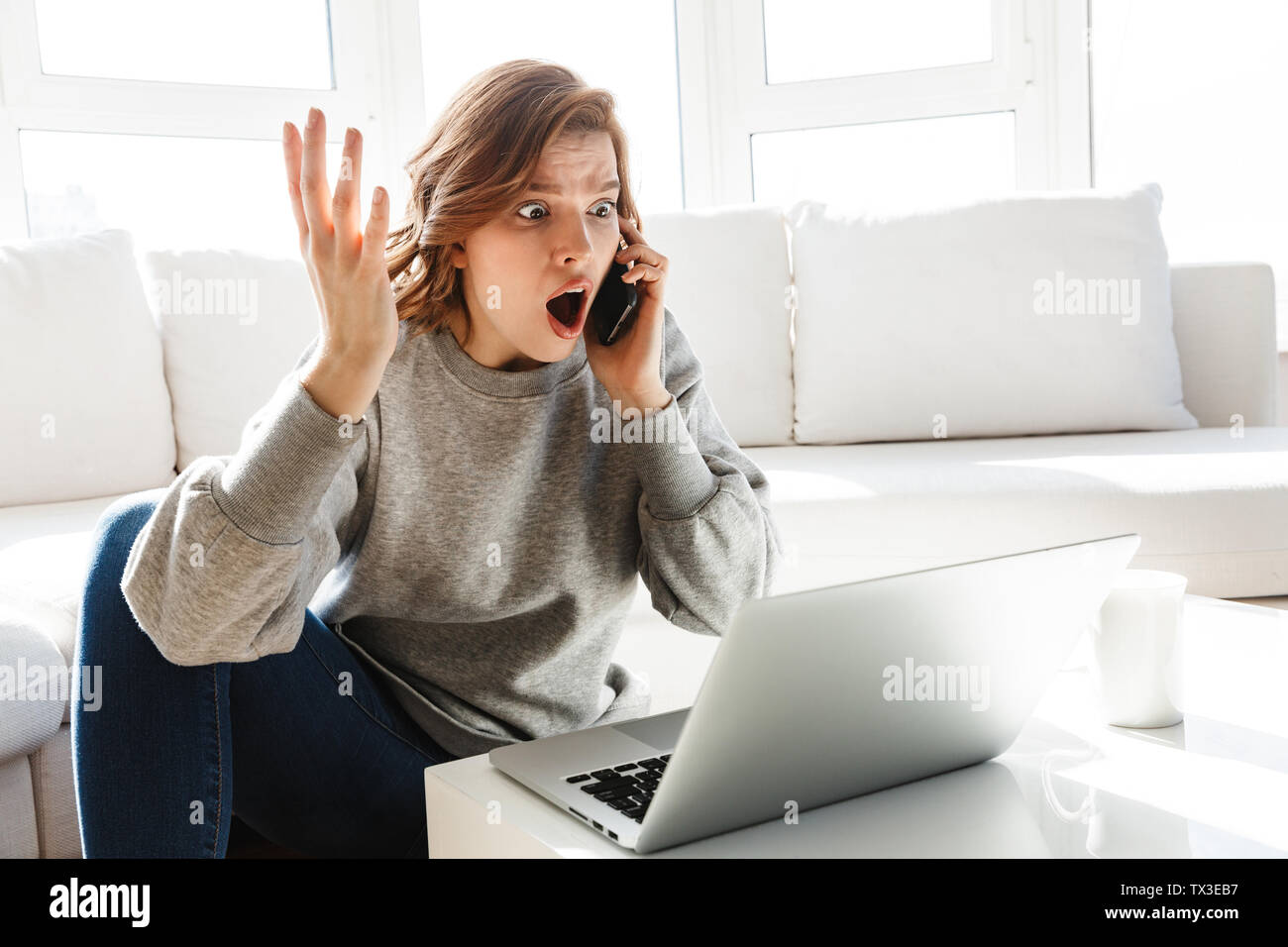 Excited woman computer home hi-res stock photography and images - Alamy