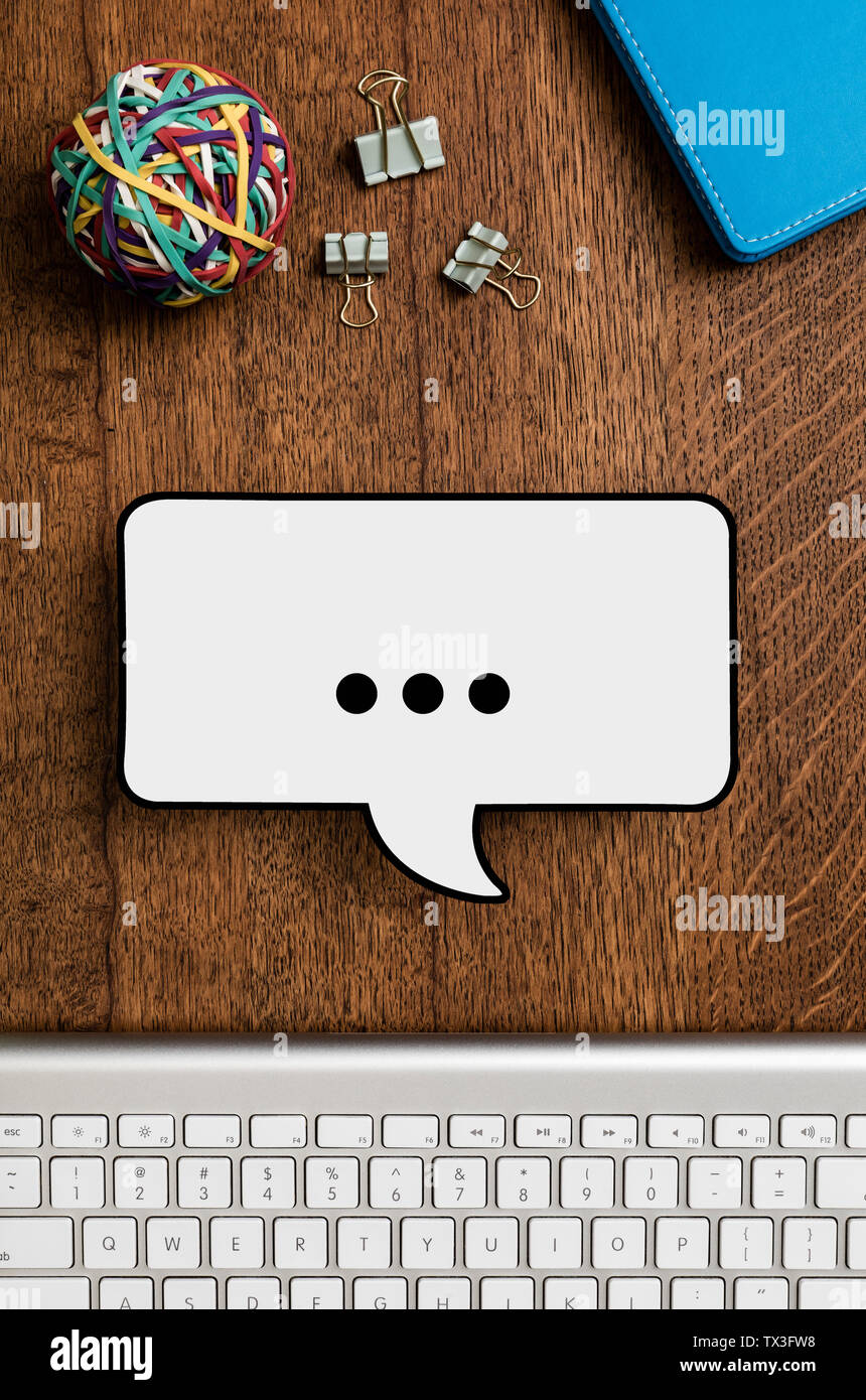 View from above paper speech bubble on wooden desk Stock Photo - Alamy