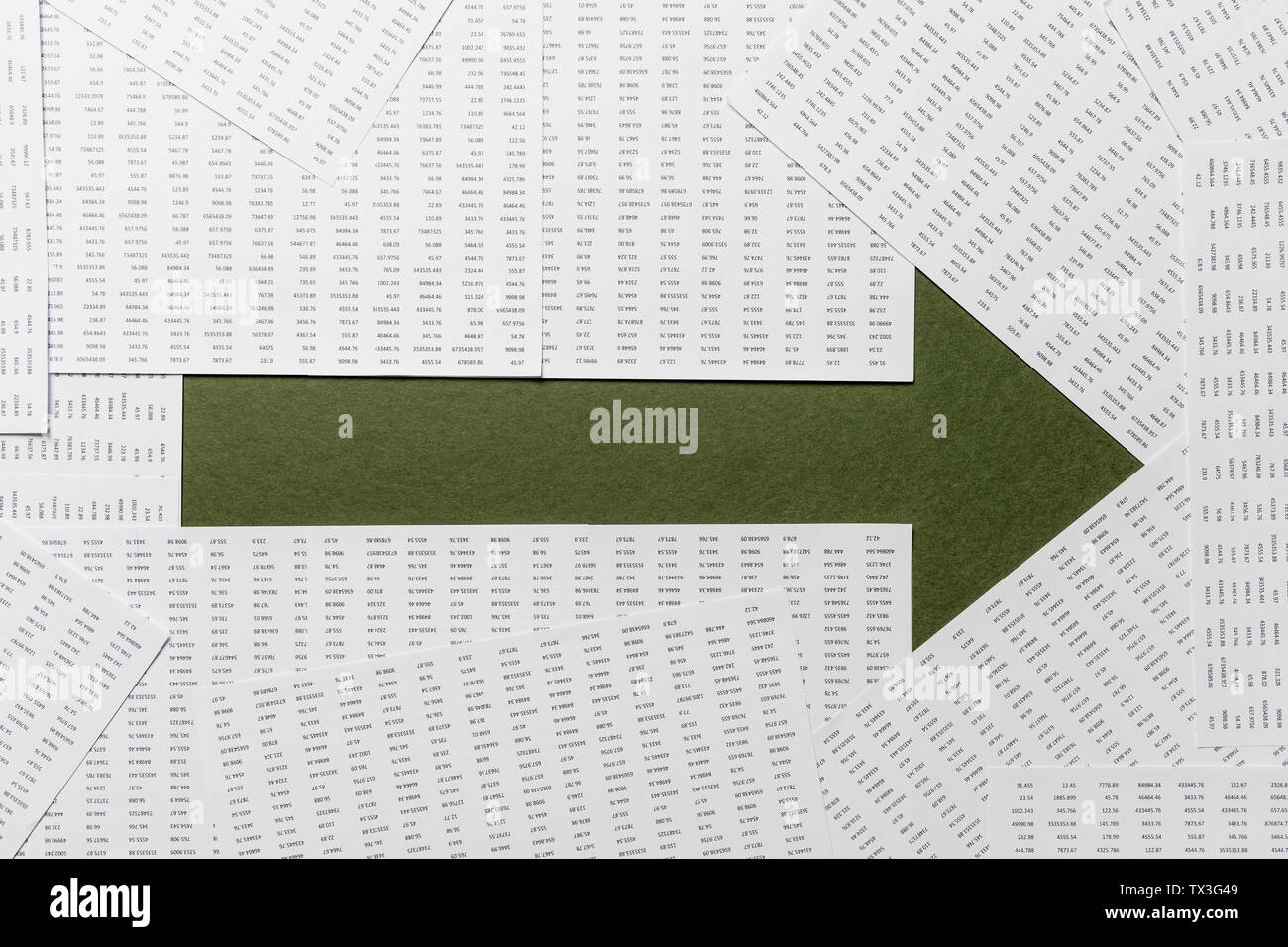 View from above green arrow among paperwork Stock Photo - Alamy