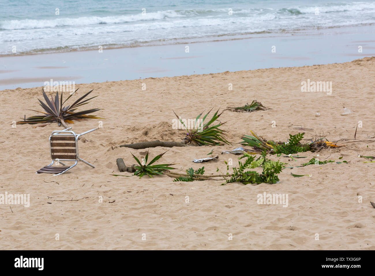 debris and damage left behind on the beach after a busy day at ...