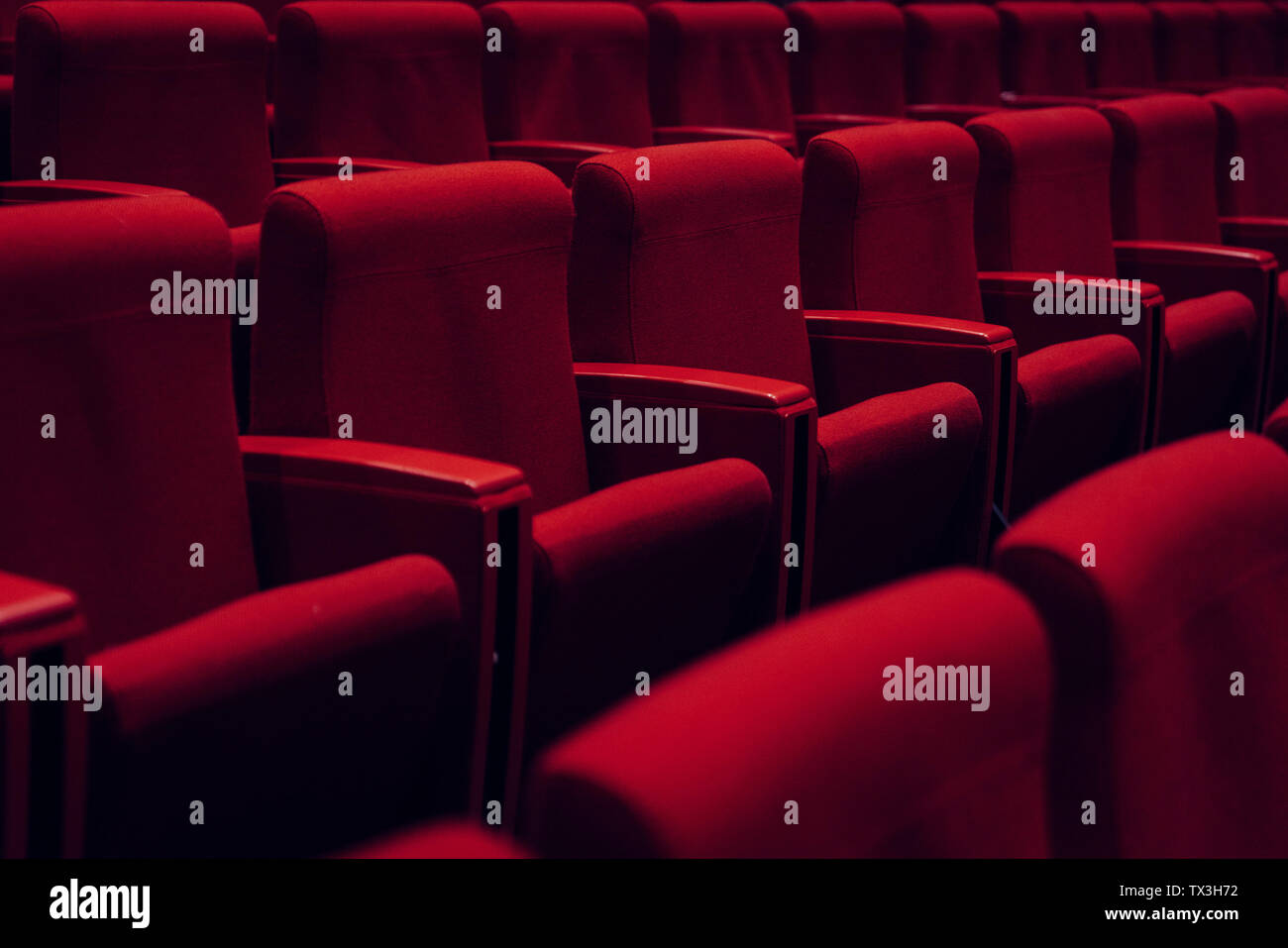 Red theater seats in a row Stock Photo - Alamy
