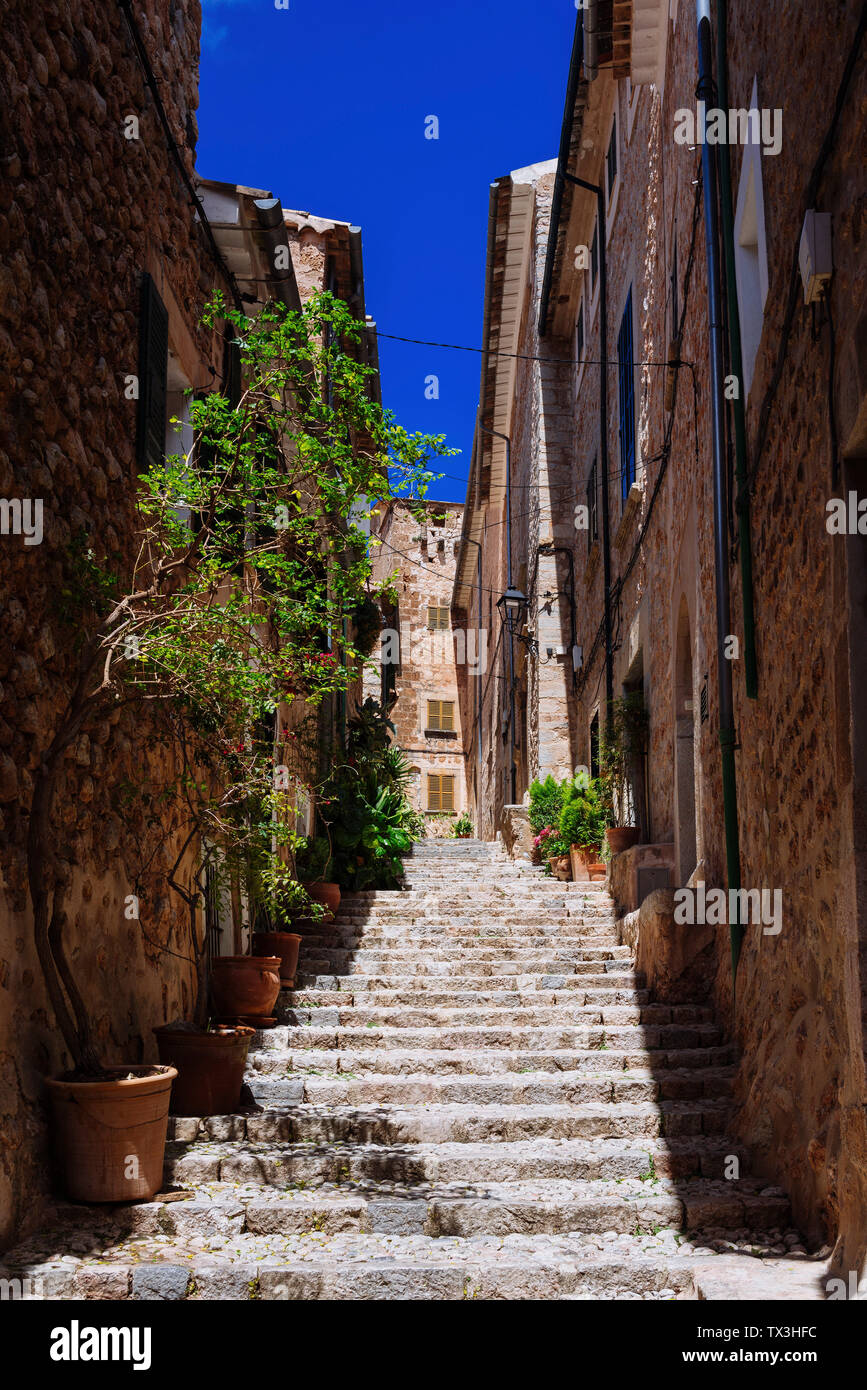Sunny stone steps between buildings, Fornalutx, Mallorca, Balearic ...