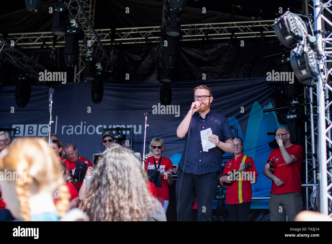 BBC Radio DJ Huw Stephens introduces a band during the Tafwyl festival ...