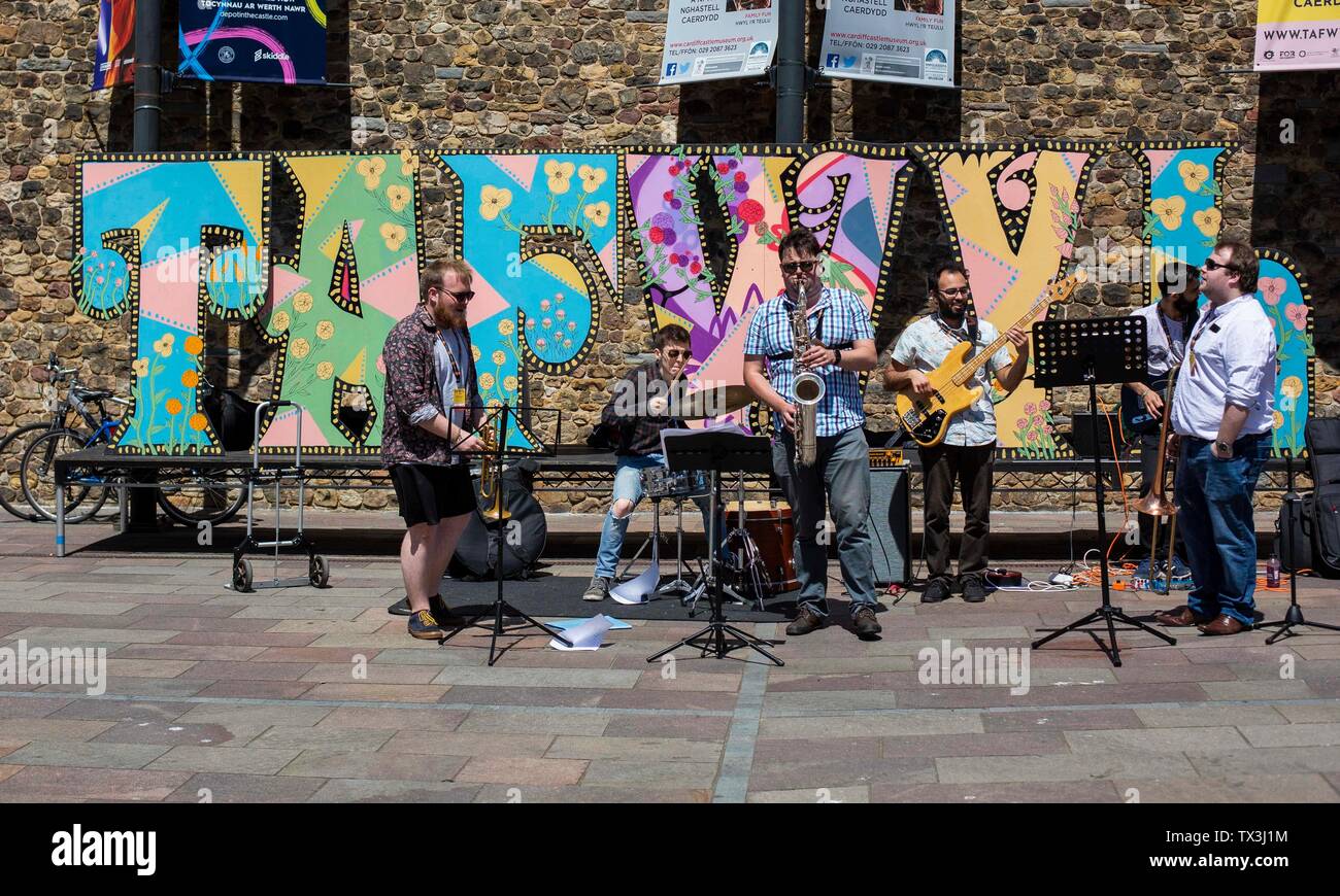 A band play in front of a Tafwyl sign during day two of the Tafwyl ...