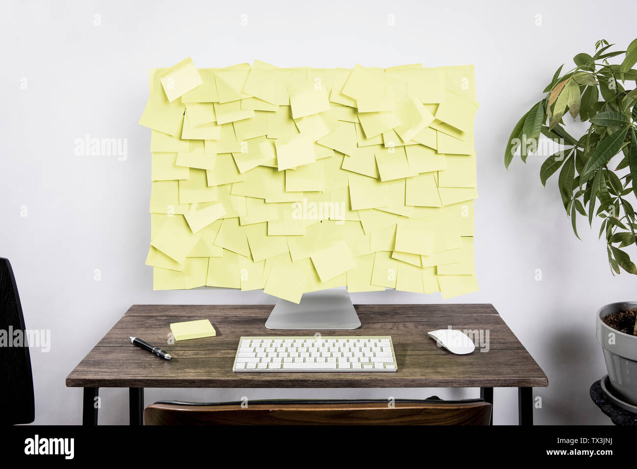 Adhesive notes covering computer on desk in office Stock Photo - Alamy