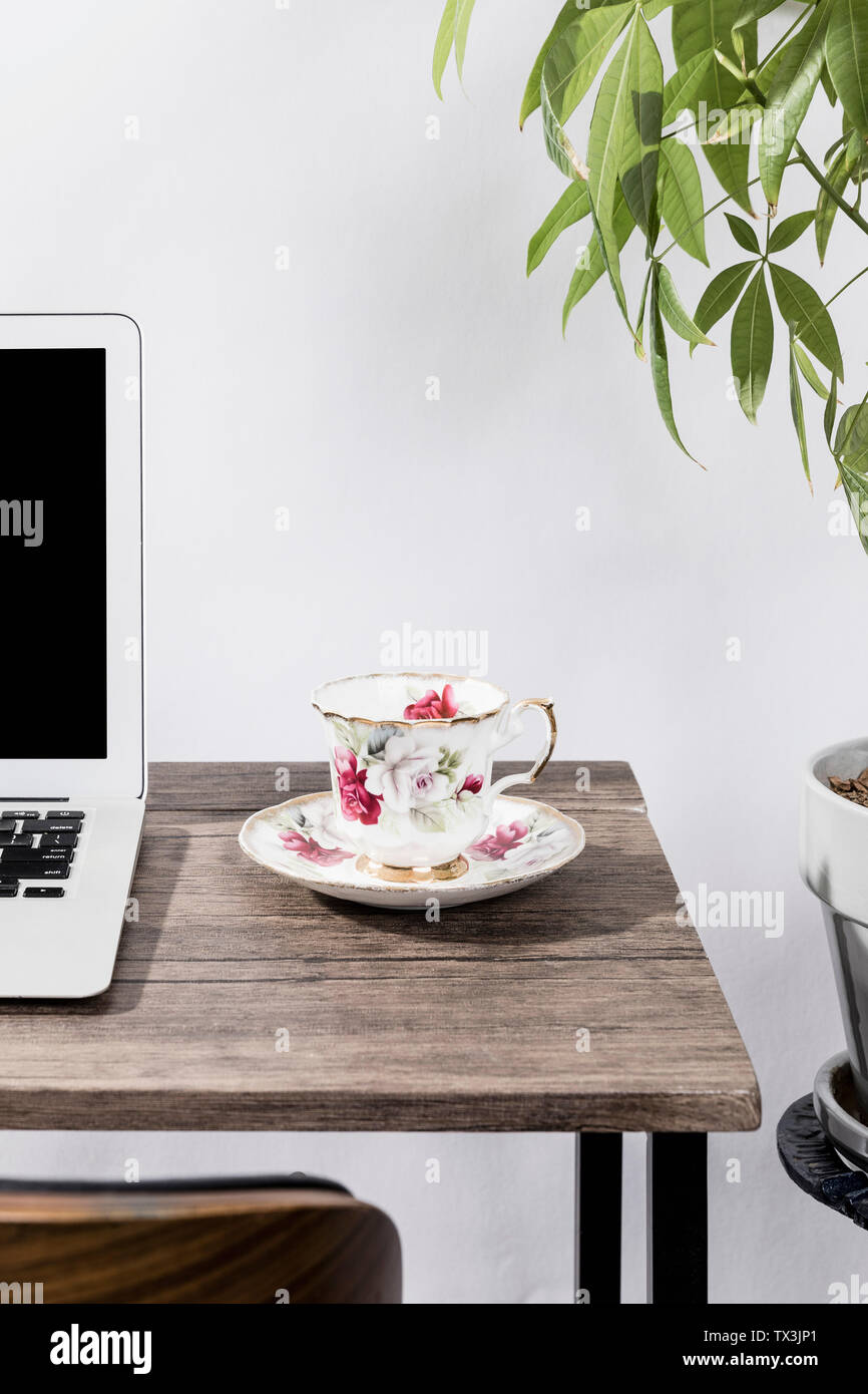 Cup tea laptop on desk hi-res stock photography and images - Alamy
