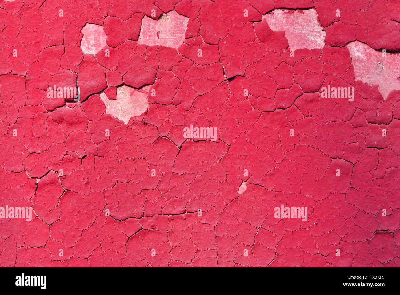 Cracked red paint, plaster surface on wall, grunge horizontal shabby ...