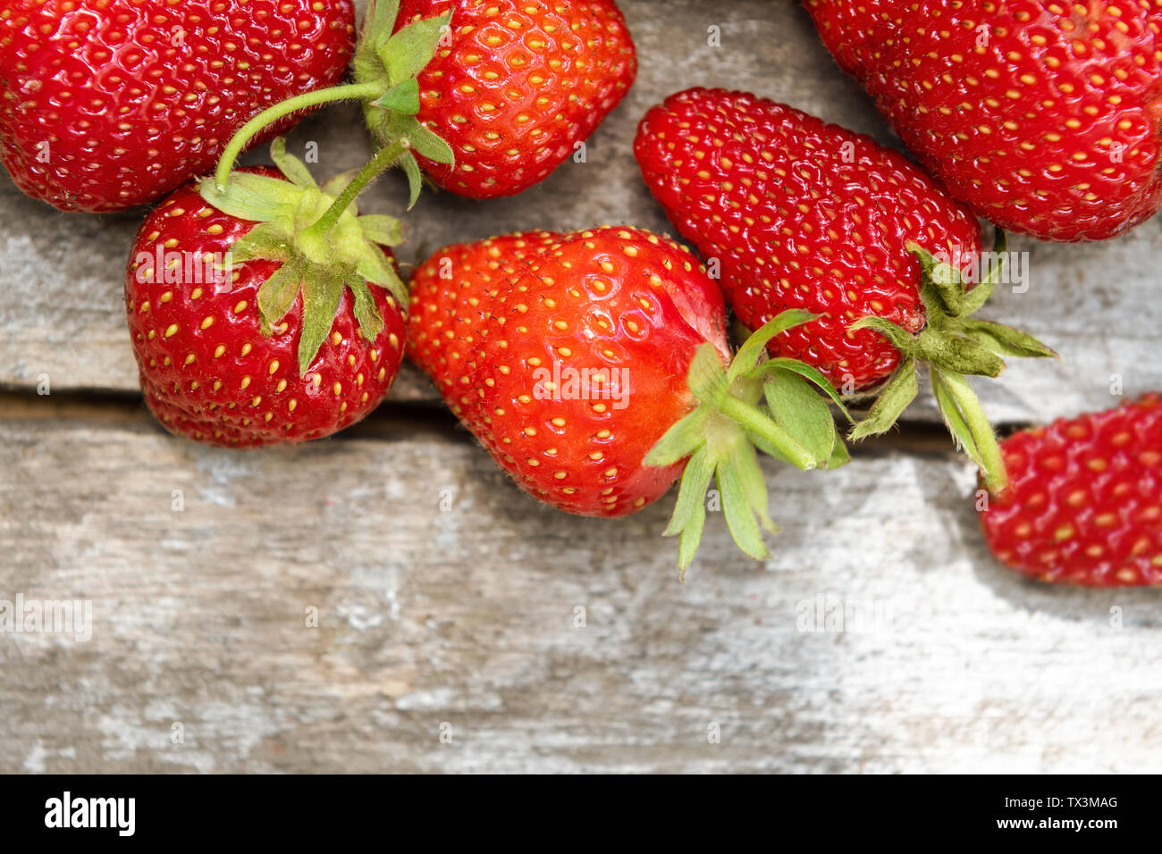 Fresh strawberry on wooden background, close up Stock Photo - Alamy