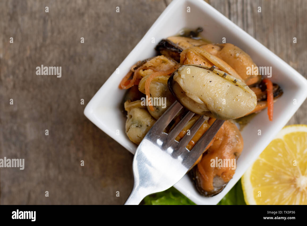 Pickled mussels with carrot, lemon juice and oil Stock Photo - Alamy