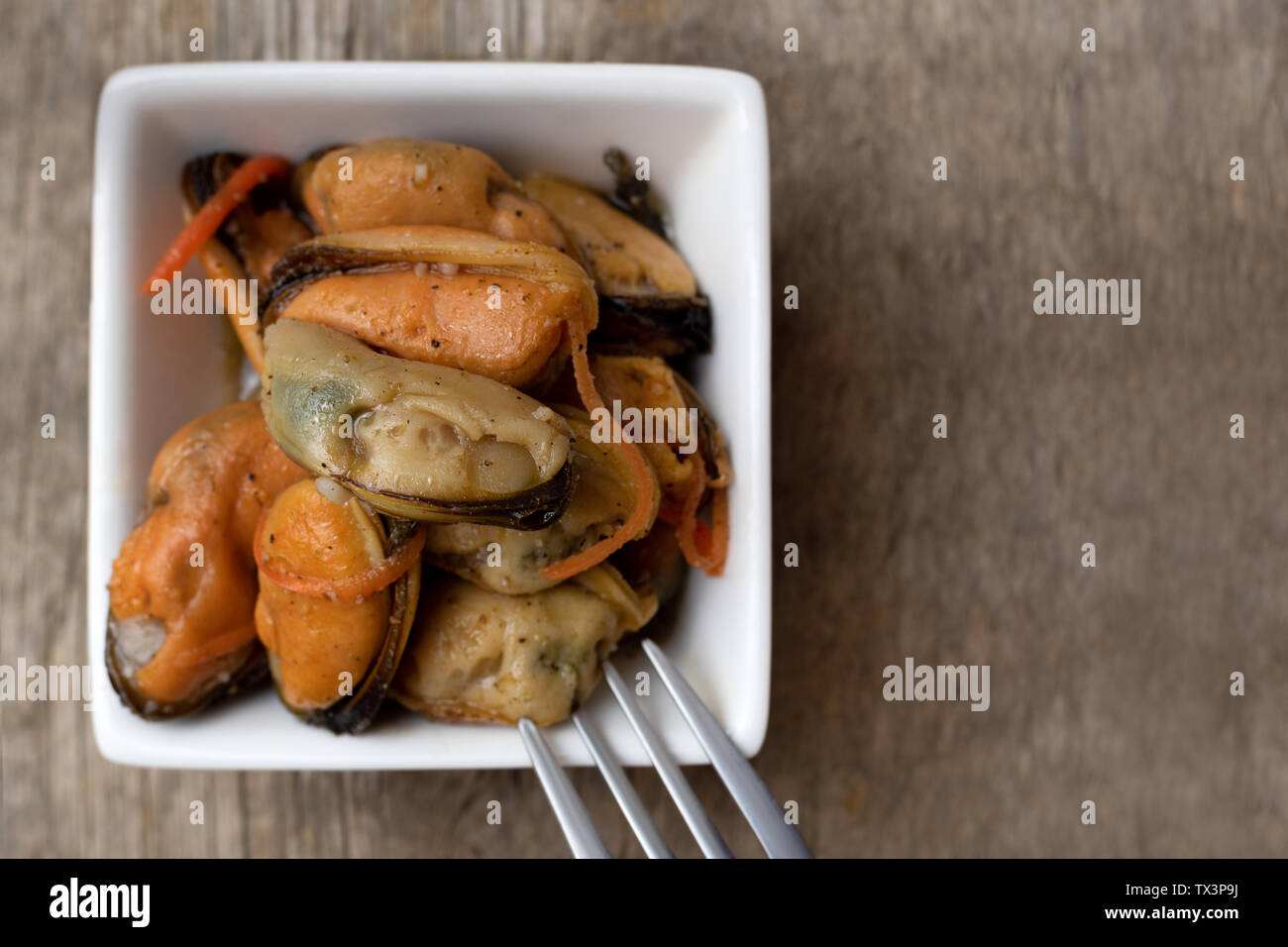 Pickled mussels with carrot, lemon juice and oil Stock Photo - Alamy