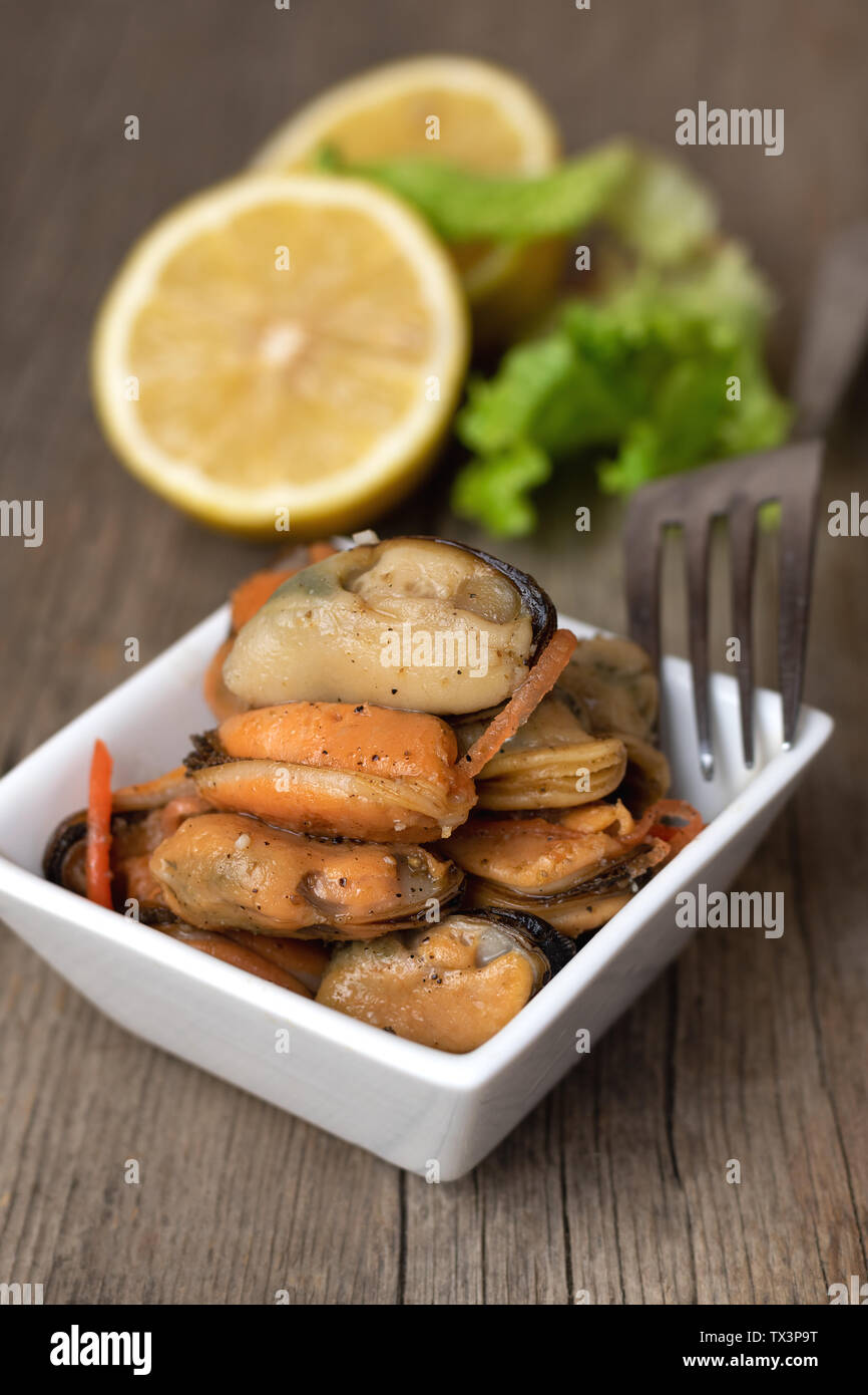 Pickled mussels with carrot, lemon juice and oil Stock Photo - Alamy