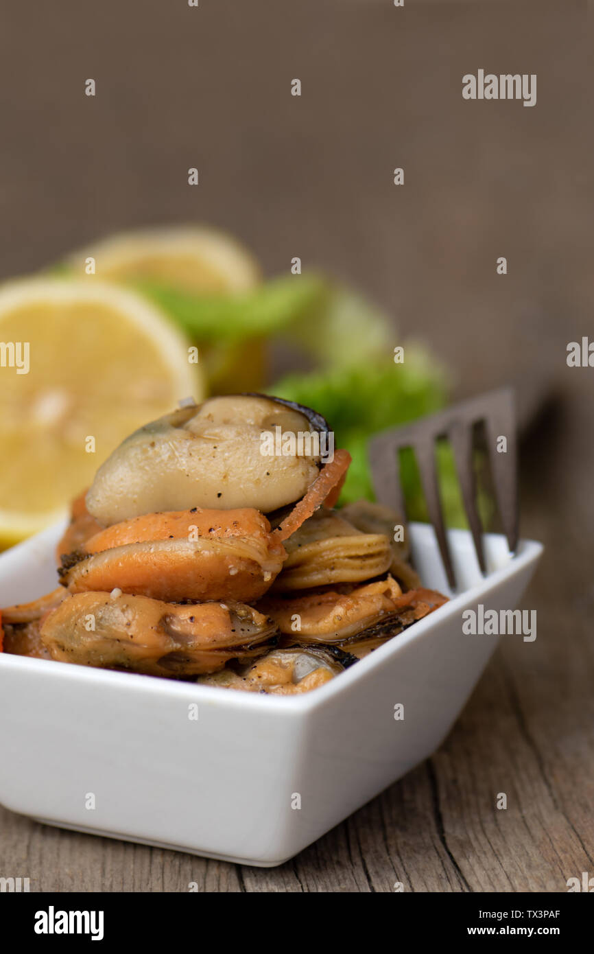 Pickled mussels with carrot, lemon juice and oil Stock Photo - Alamy