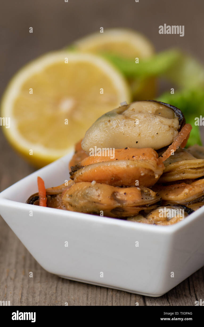 Pickled mussels with carrot, lemon juice and oil Stock Photo - Alamy