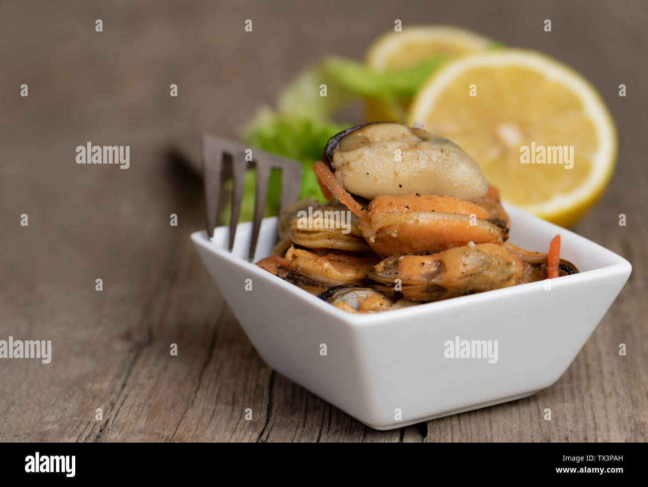 Pickled mussels with carrot, lemon juice and oil Stock Photo - Alamy