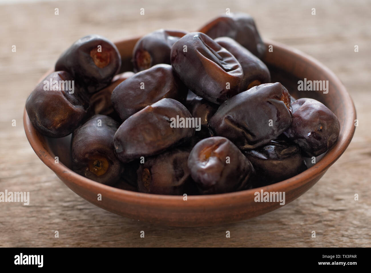 Date fruit on wooden background, close up Stock Photo - Alamy
