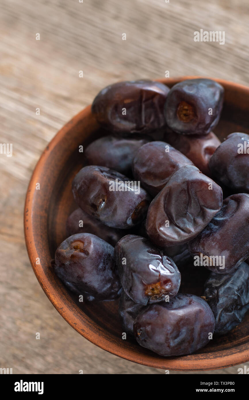Date fruit on wooden background, close up Stock Photo - Alamy