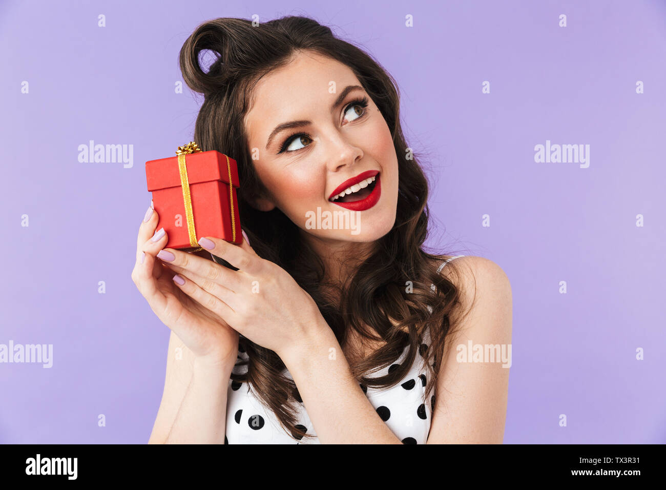 Portrait of happy pin-up woman 20s in vintage polka dot dress smiling ...