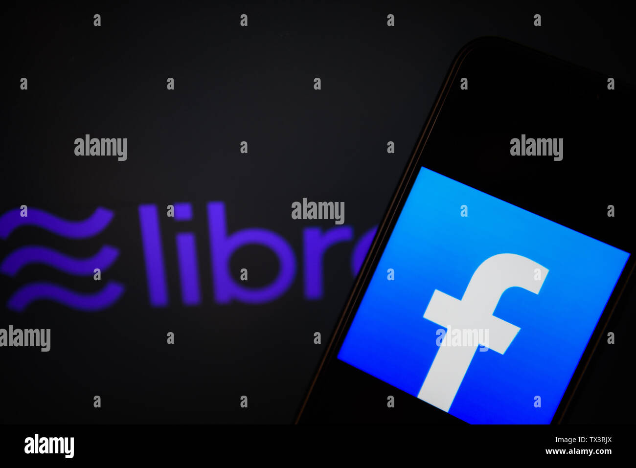 In this photo illustration a facebook logo seen displayed on a ...