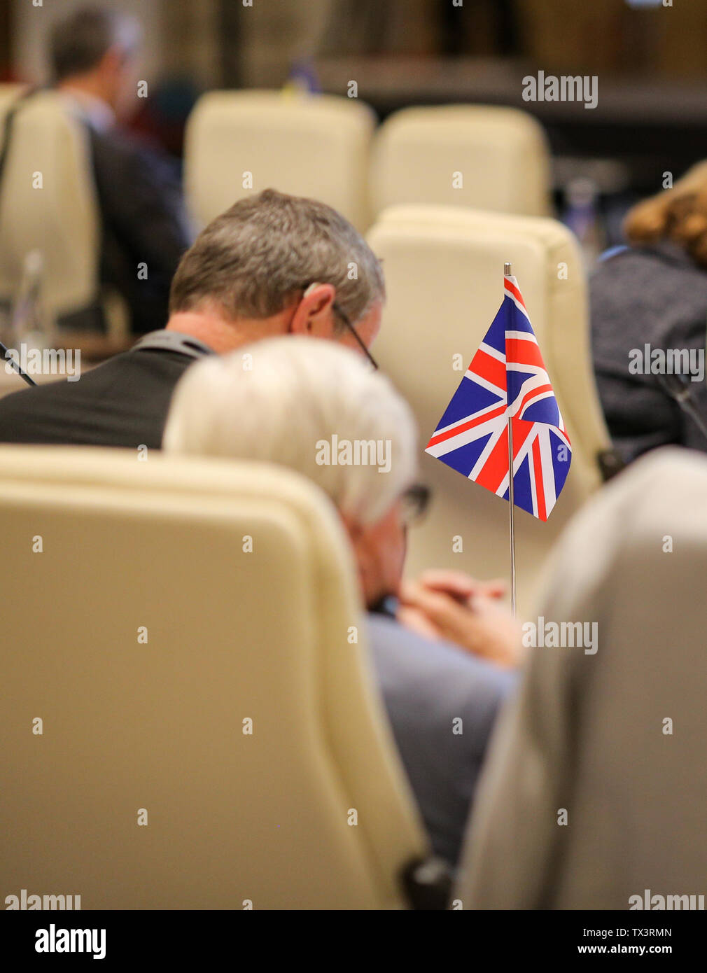 Details with the flag of the United Kingdom during a conference of ...