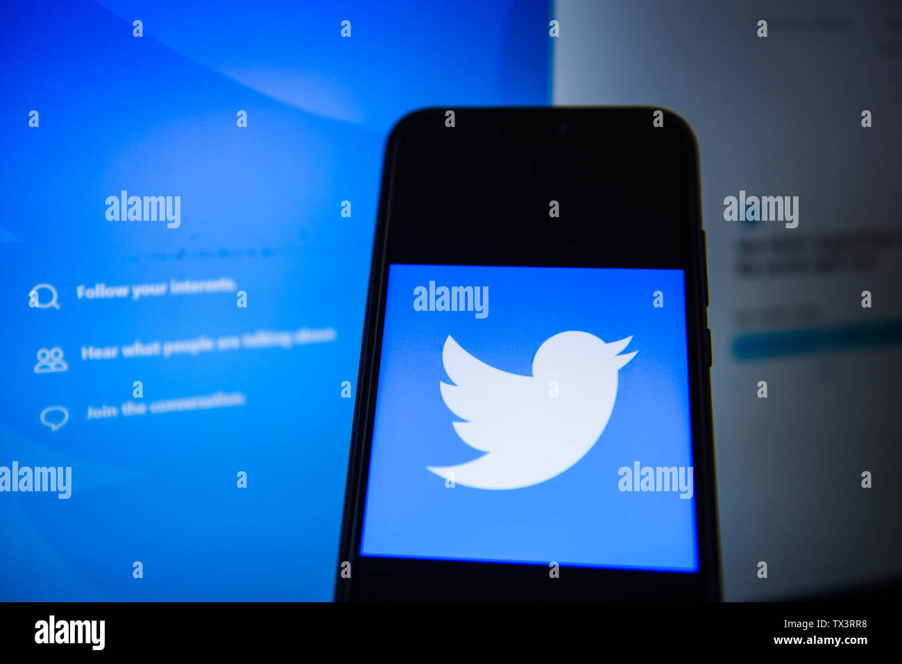 In this photo illustration a Twitter logo seen displayed on a ...