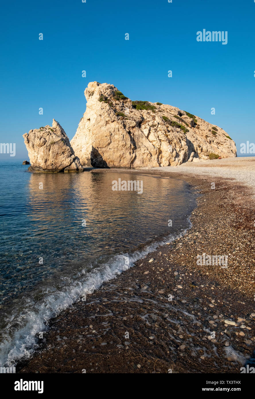 Early morning sunshine illuminates Aphrodite's Rock (Petra Tou Romiou ...